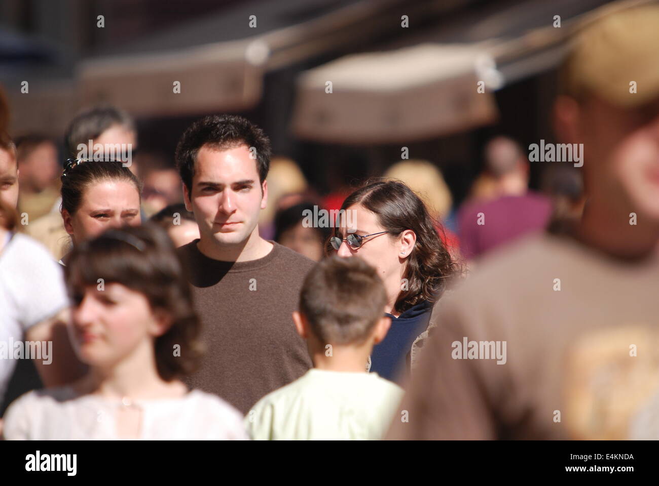 happy man walking in crowd Stock Photo - Alamy