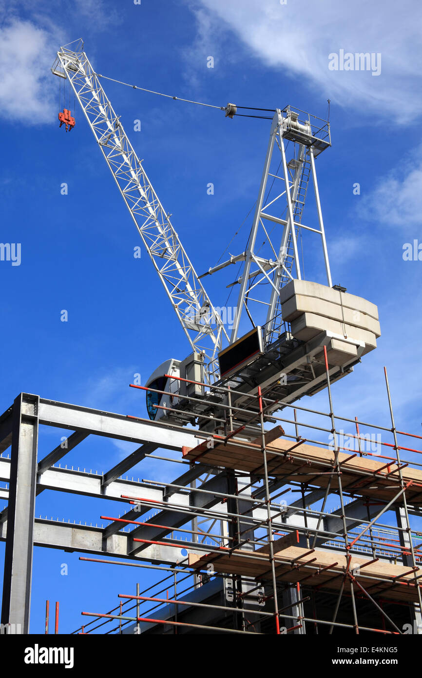 Scaffolding and crane on a construction site hi-res stock photography ...