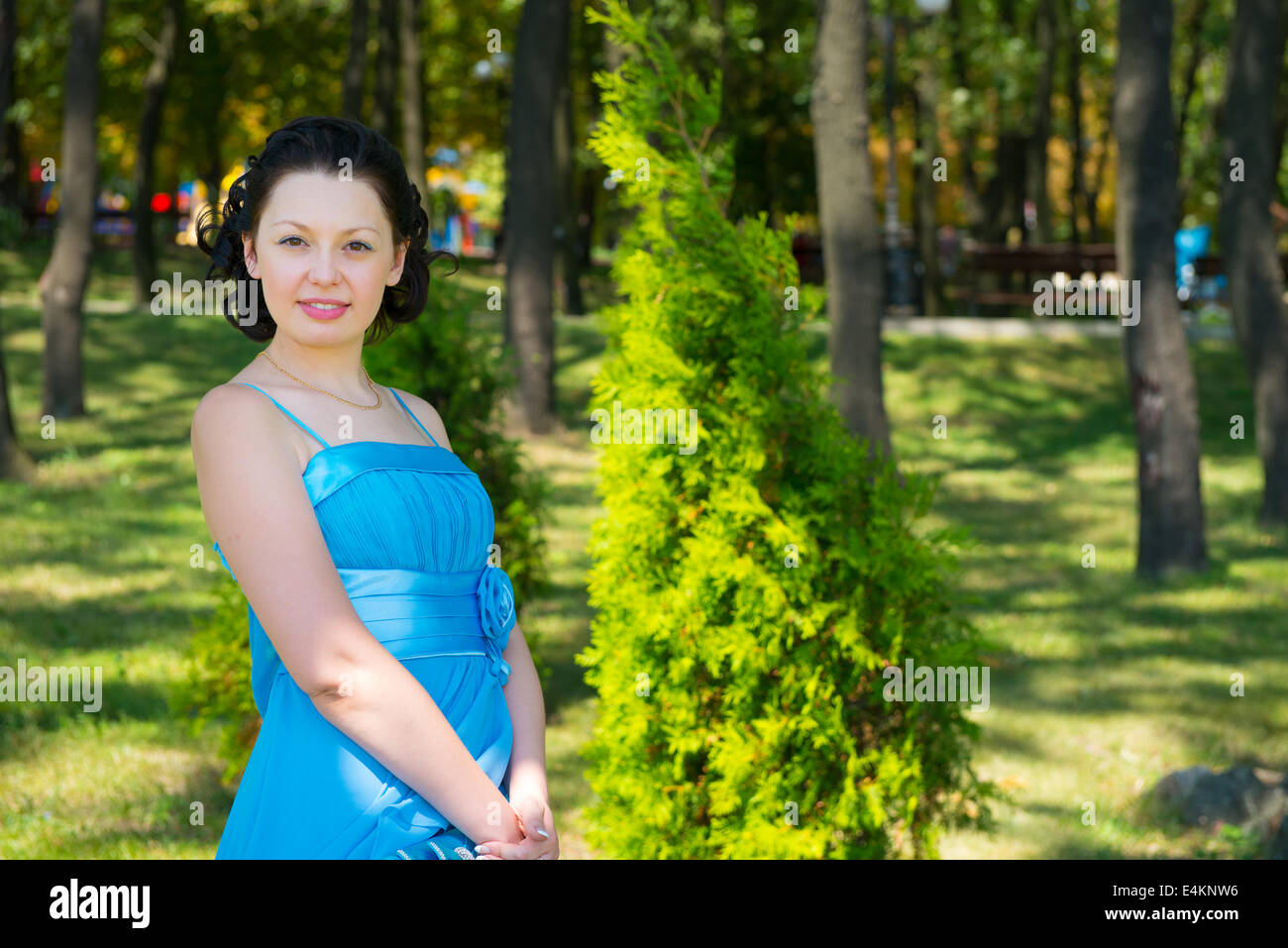 A beautiful woman in a blue dress Stock Photo - Alamy