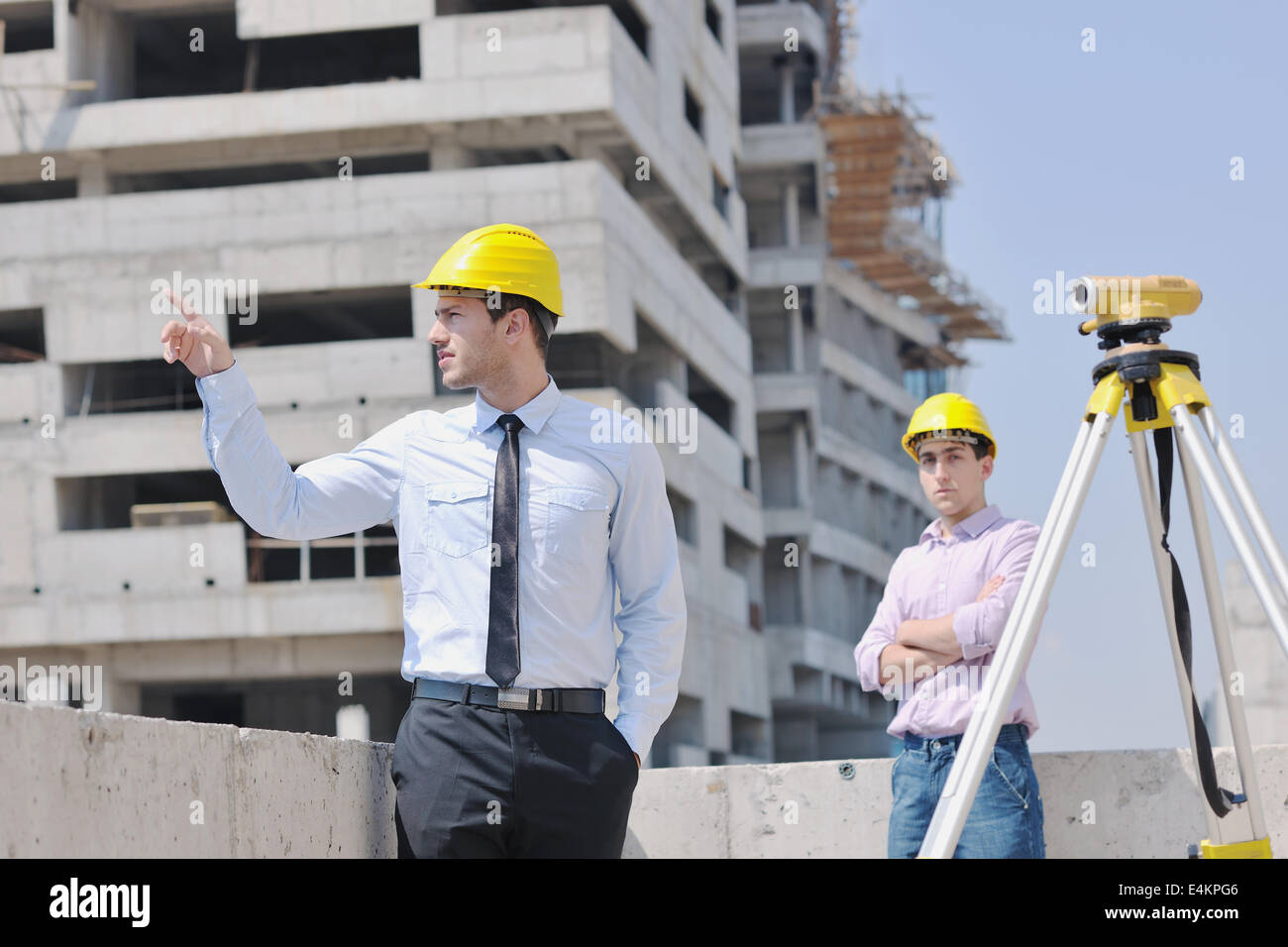 Team of architects on construciton site Stock Photo - Alamy