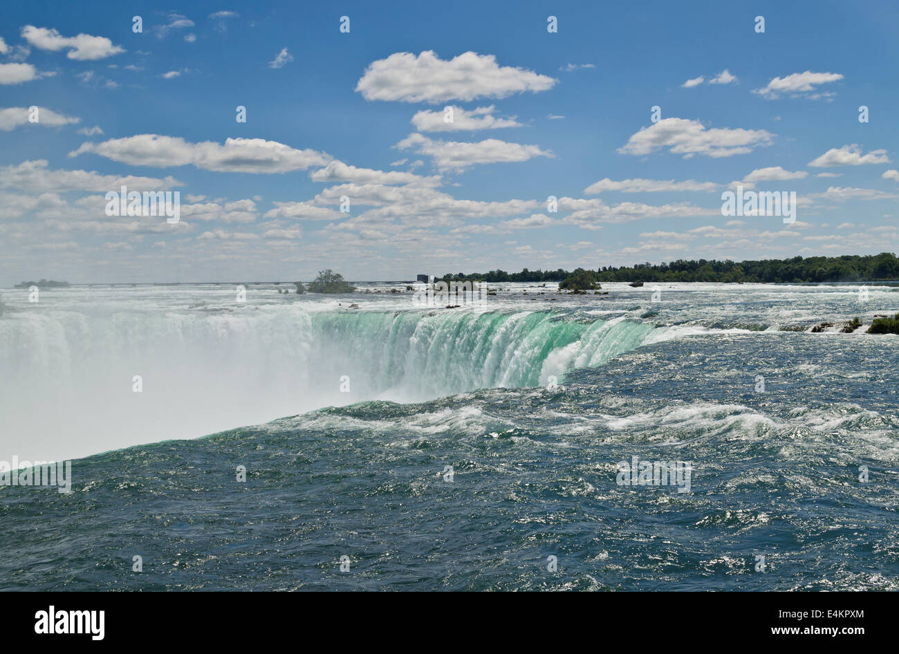 Water from the Niagara river rushing over the top of Niagara Falls ...