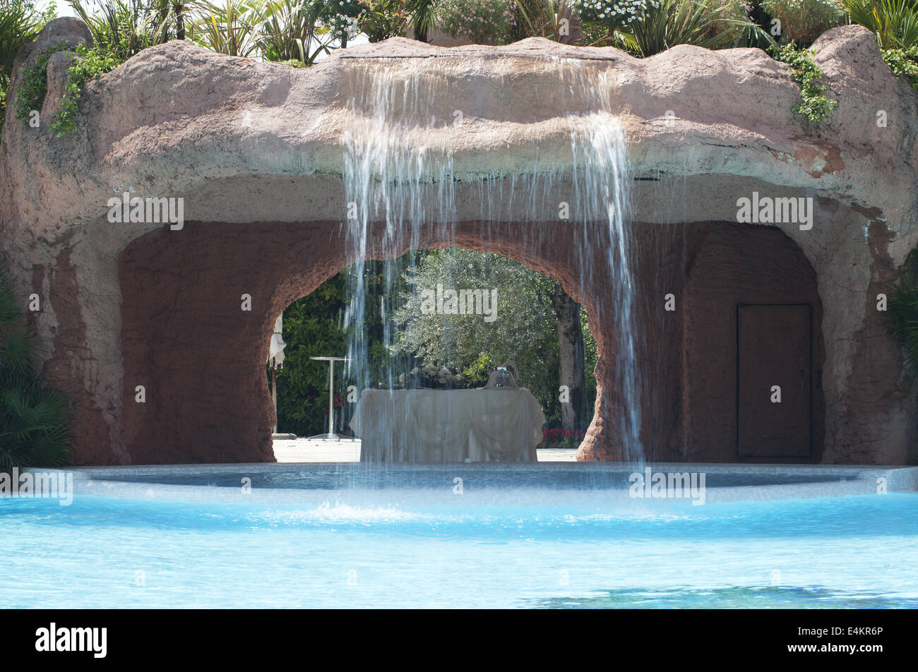 Pool and waterfall in hotel Stock Photo - Alamy