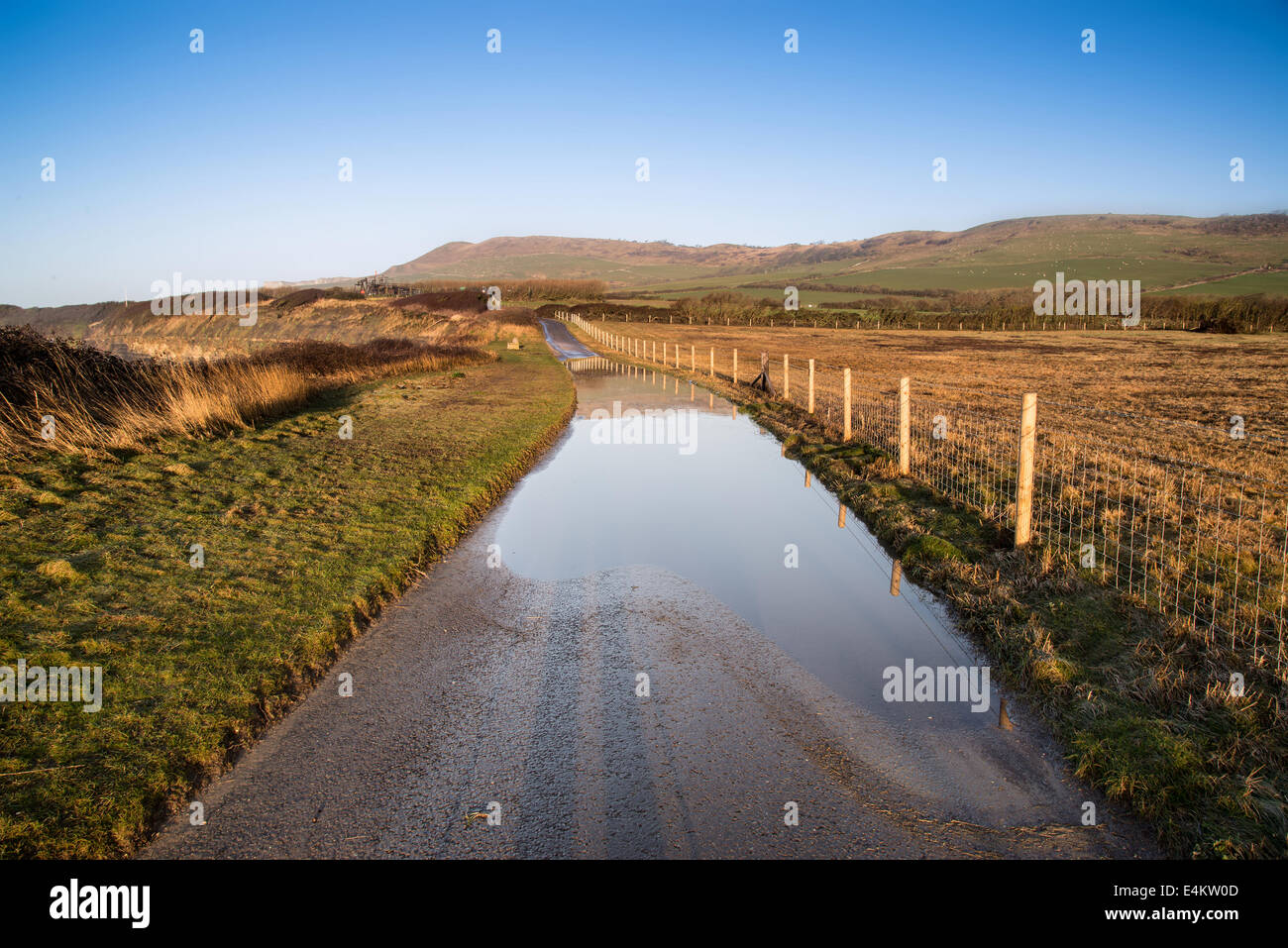 Flooded country lane farm landscape Stock Photo - Alamy