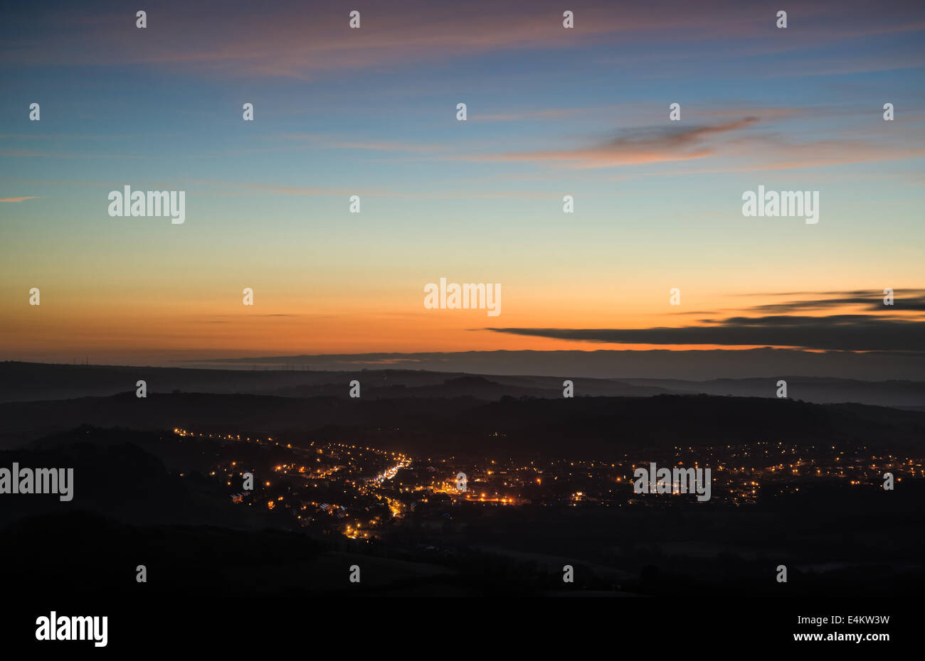 Beautiful pre-dawn landscape overlooking lights of town in valley Stock ...