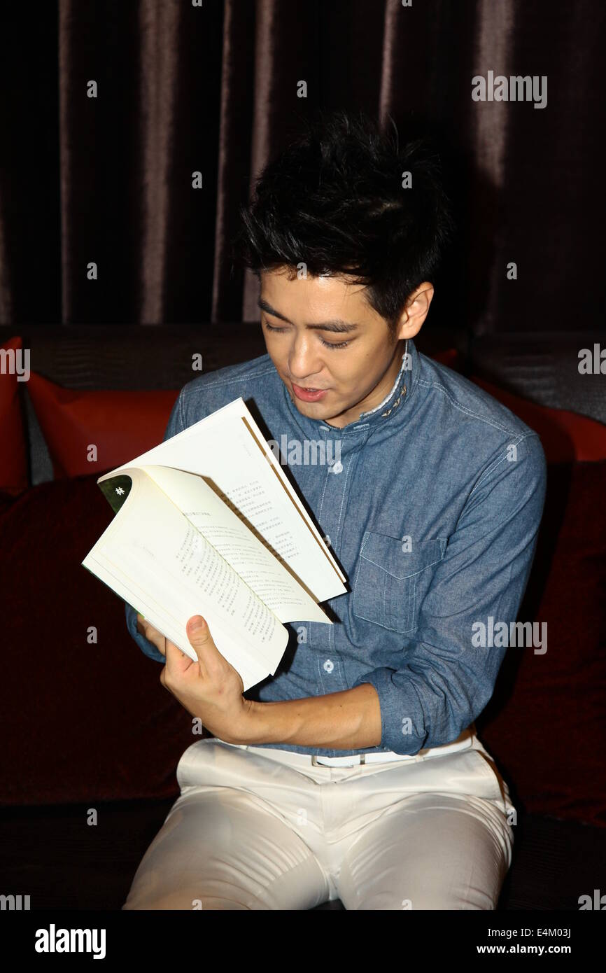 Shanghai, China. 13th July, 2014. Actor Jimmy Lin holds autograph ...