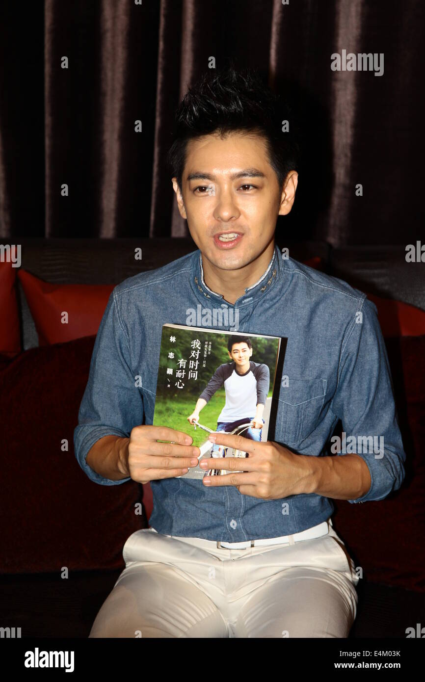Shanghai, China. 13th July, 2014. Actor Jimmy Lin holds autograph ...