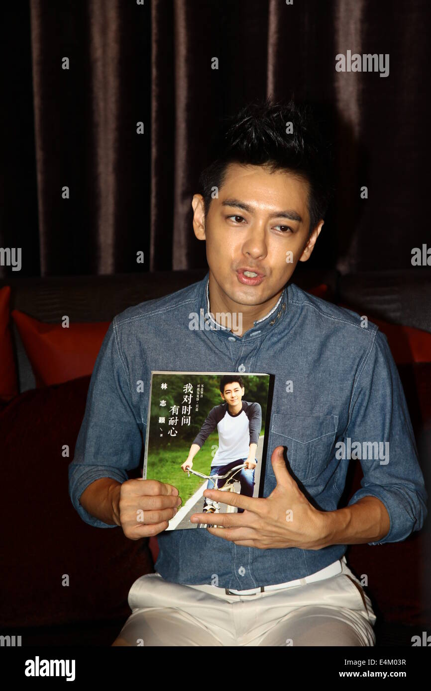 Shanghai, China. 13th July, 2014. Actor Jimmy Lin holds autograph ...