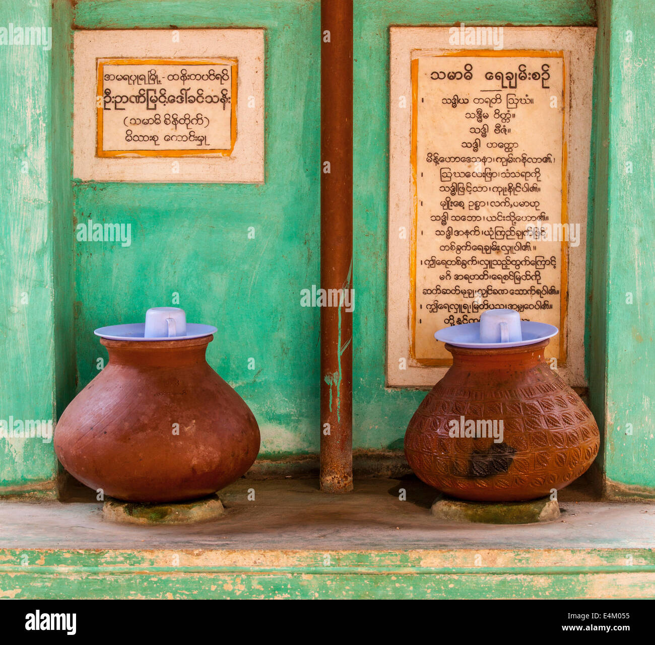 Two water pots with communal cups sit in a kiosk for monks and nuns at ...