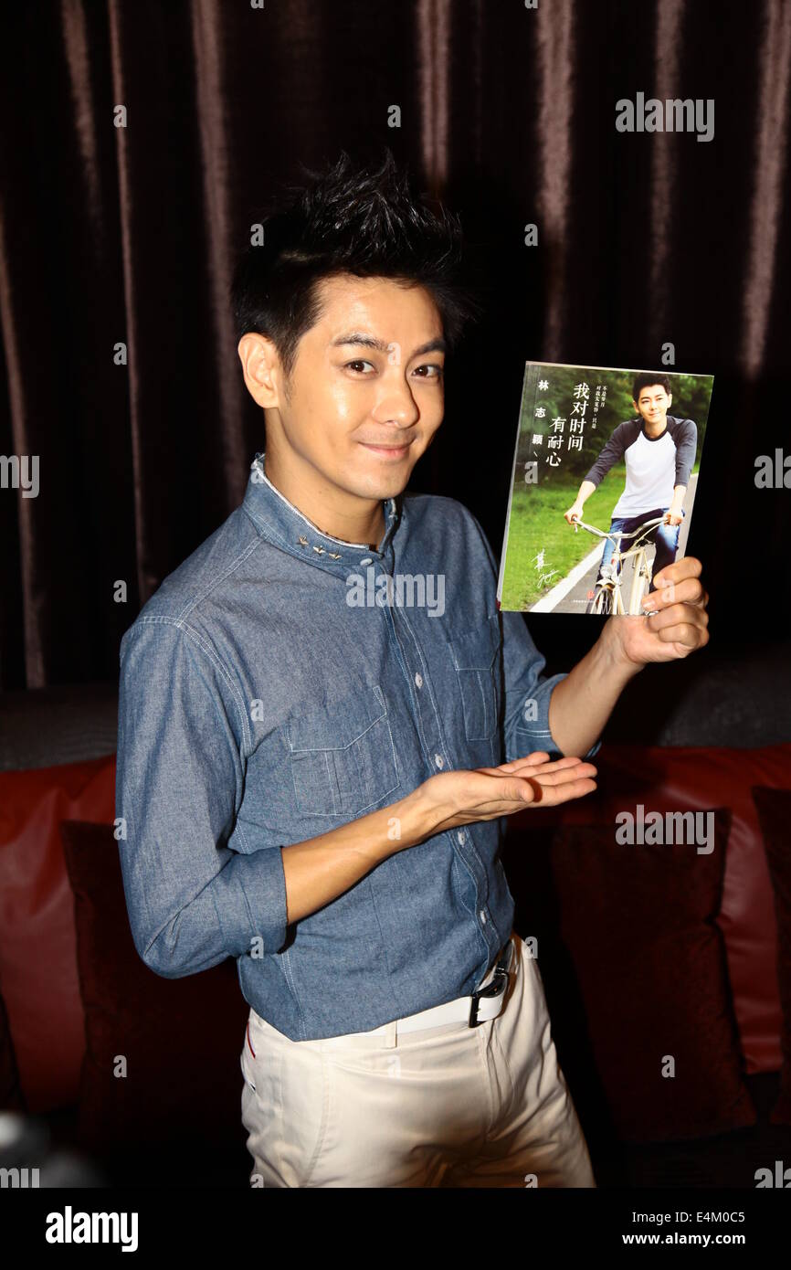 Shanghai, China. 13th July, 2014. Actor Jimmy Lin holds autograph ...