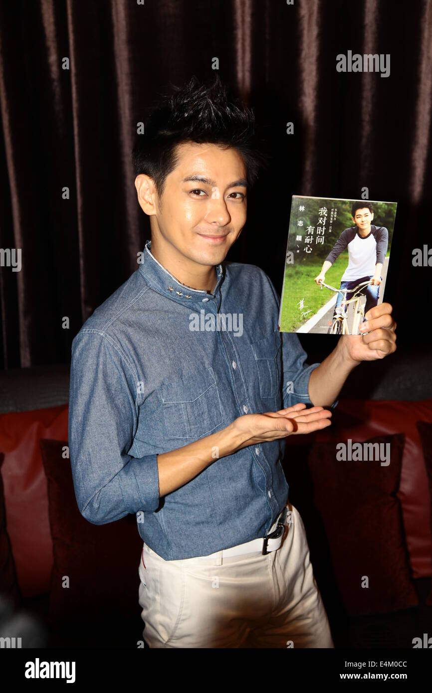 Shanghai, China. 13th July, 2014. Actor Jimmy Lin holds autograph ...