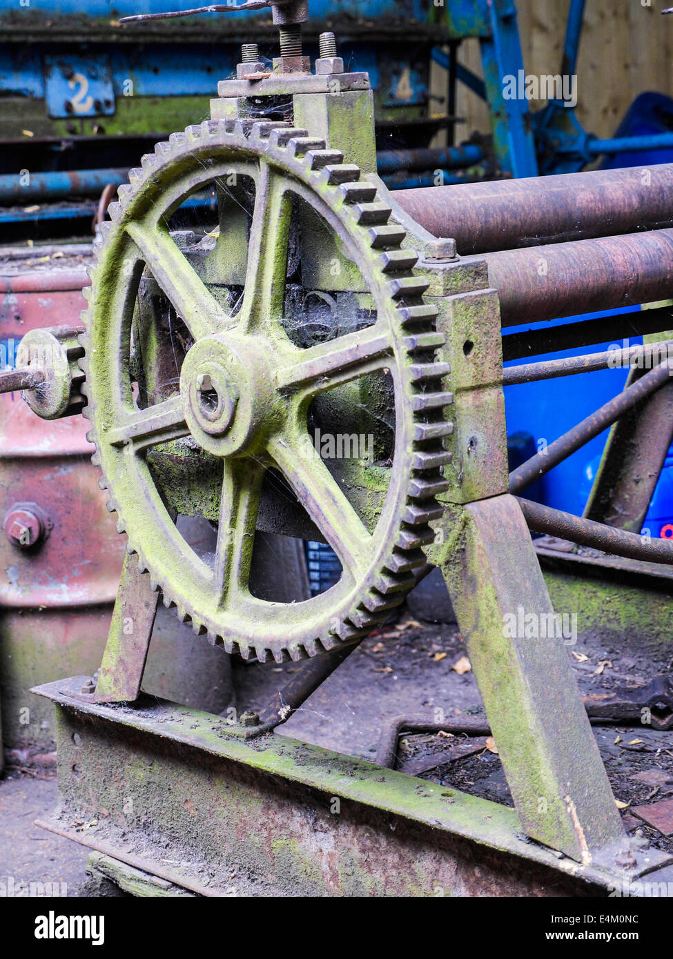 Rusty old machinery - cog wheel and rollers in working boatyard on on ...