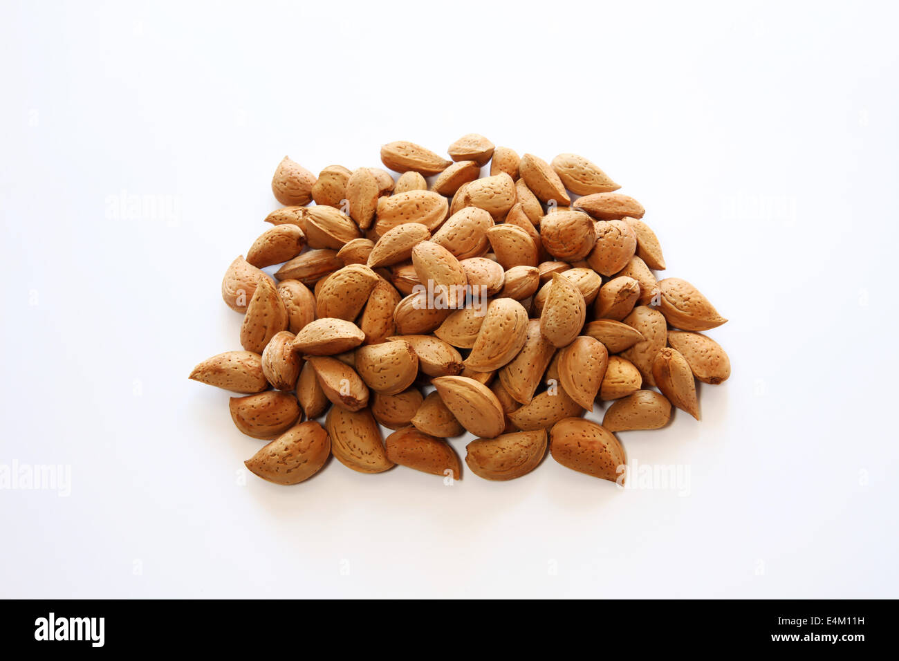 a lot of almonds in the shell in the background Stock Photo - Alamy
