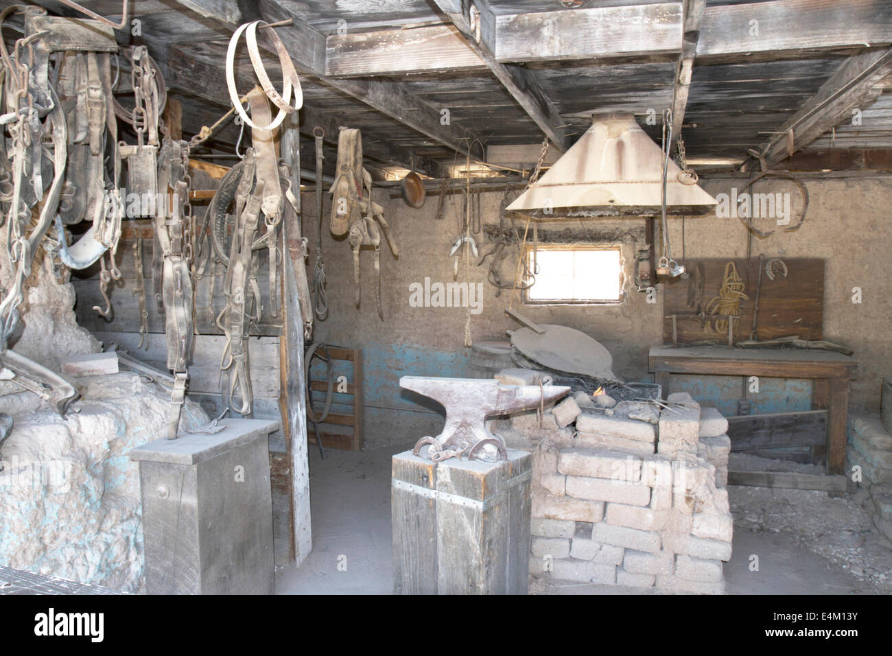 Interior of a wild west blacksmith shop adorned with bridles and reins Stock Photo - Alamy