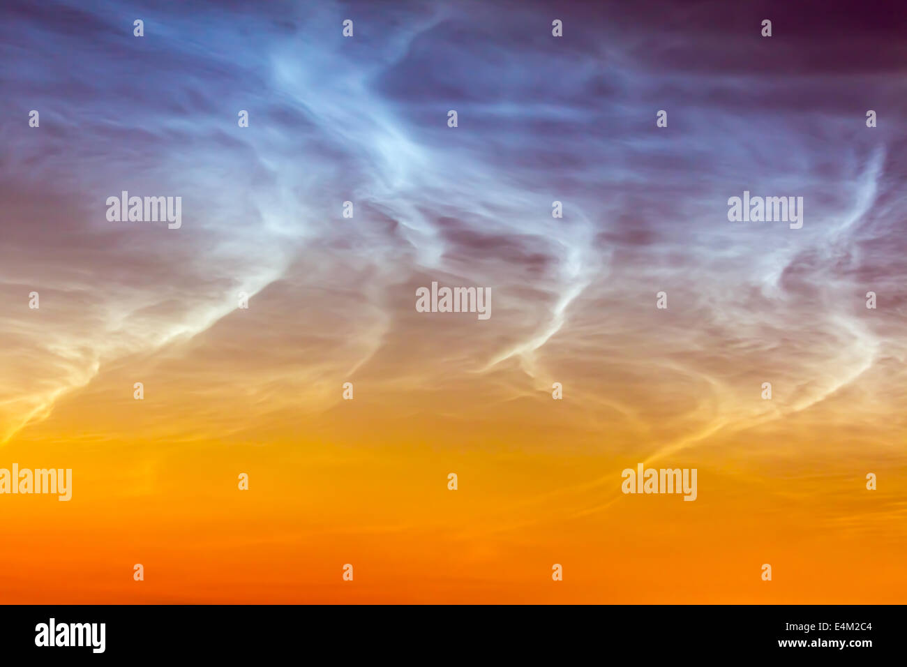 Summer Silver clouds on a background of orange sunset Stock Photo - Alamy