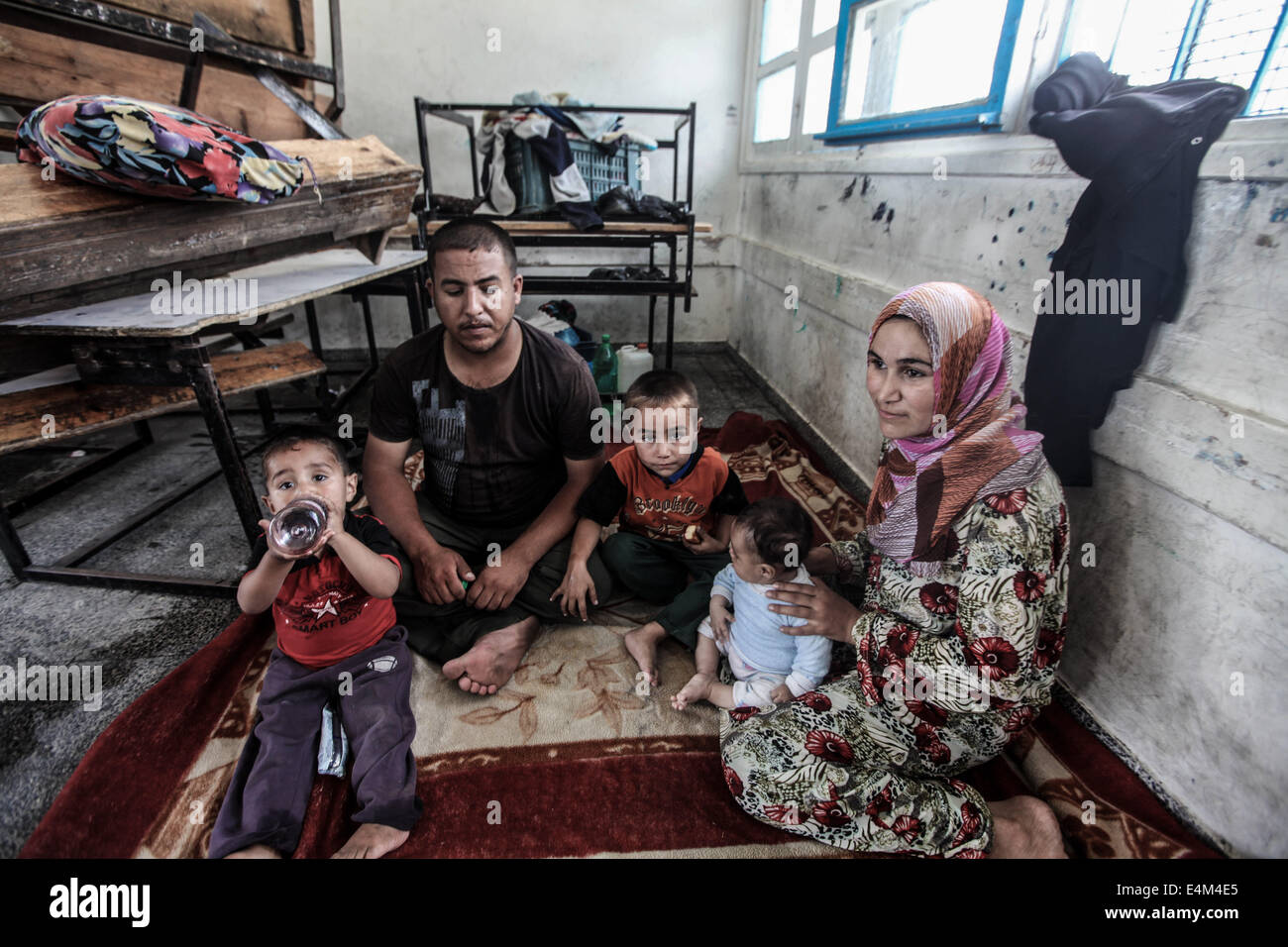 Gaza, Palestinian Territories. 13th July, 2014. A Palestinian family in ...