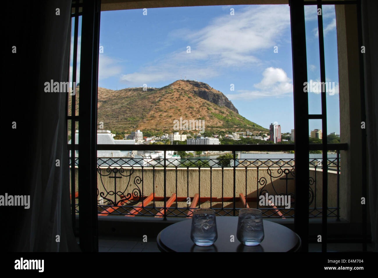picture window view of a hill in Port Louis in Mauritius from the ...