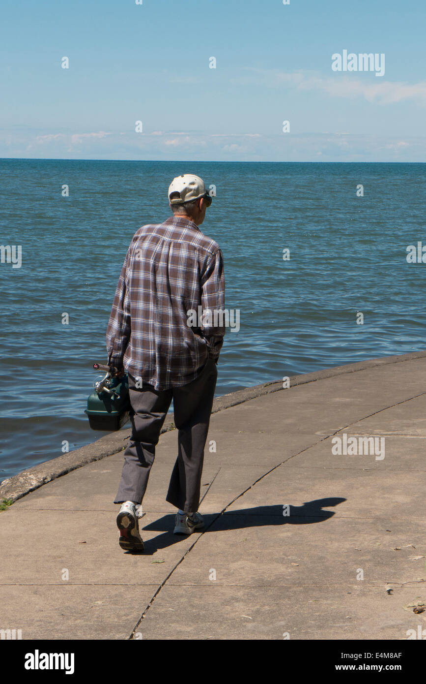 Older man walking alone hi-res stock photography and images - Alamy