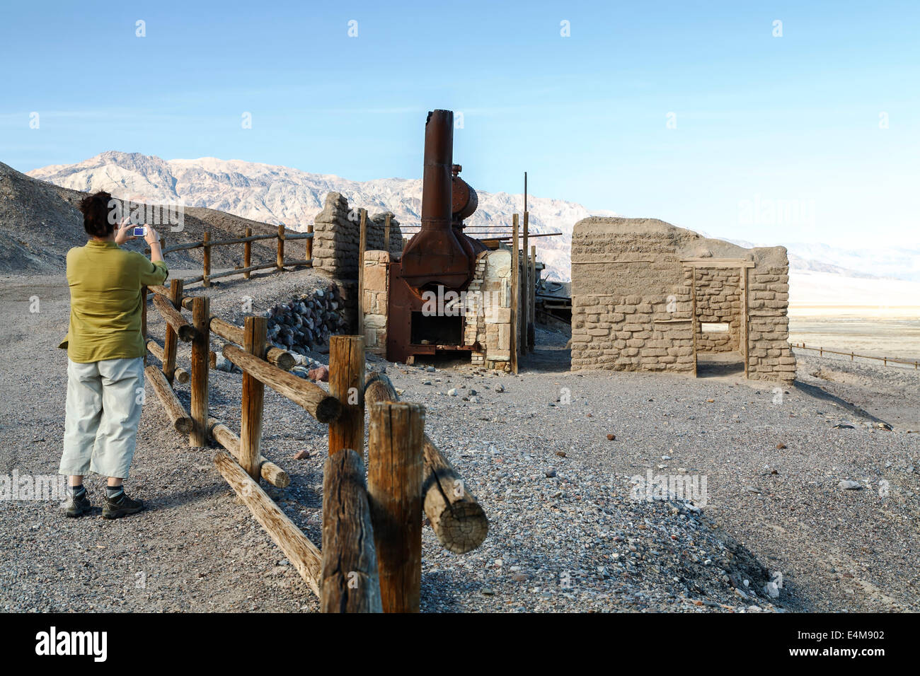 Tourist taking photo of mine ruins, Harmony Borax Works Interpretive ...