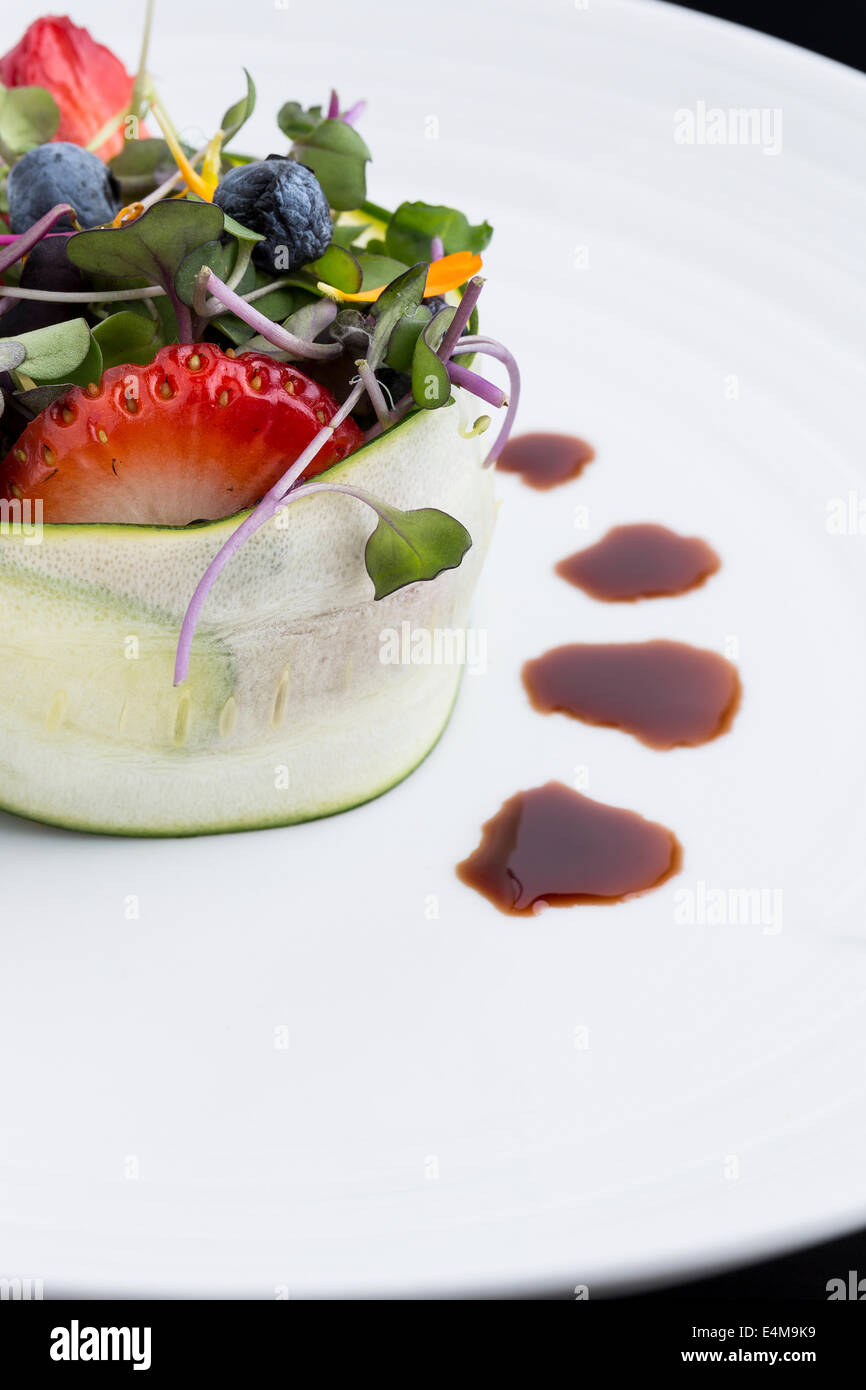 Gourmet berry salad with microherbs and dressing Stock Photo - Alamy