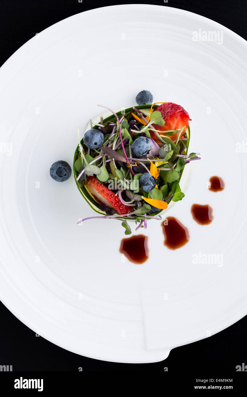 Gourmet berry salad with microherbs and dressing Stock Photo - Alamy