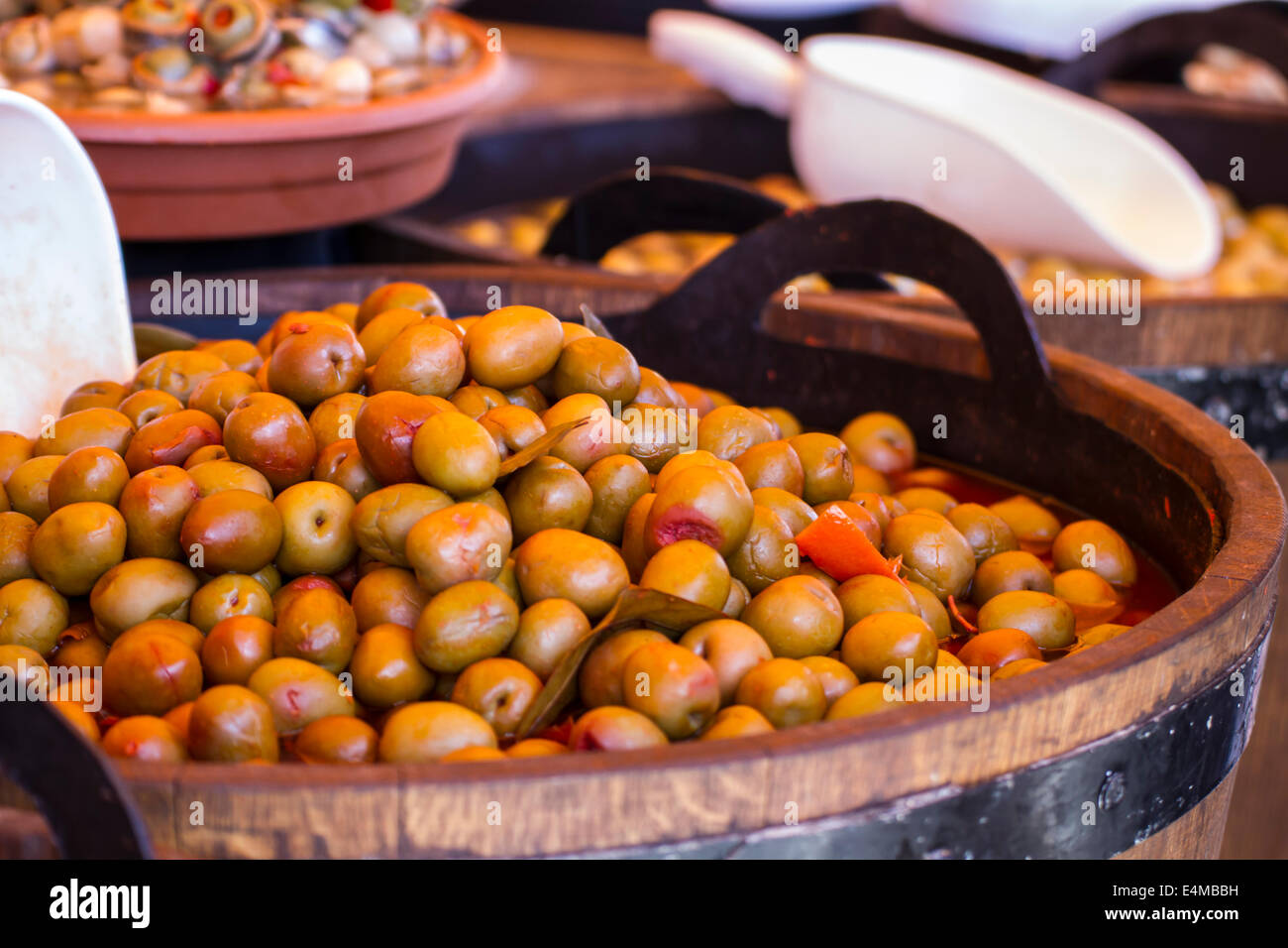 Wooden drums with olives and variants Stock Photo - Alamy