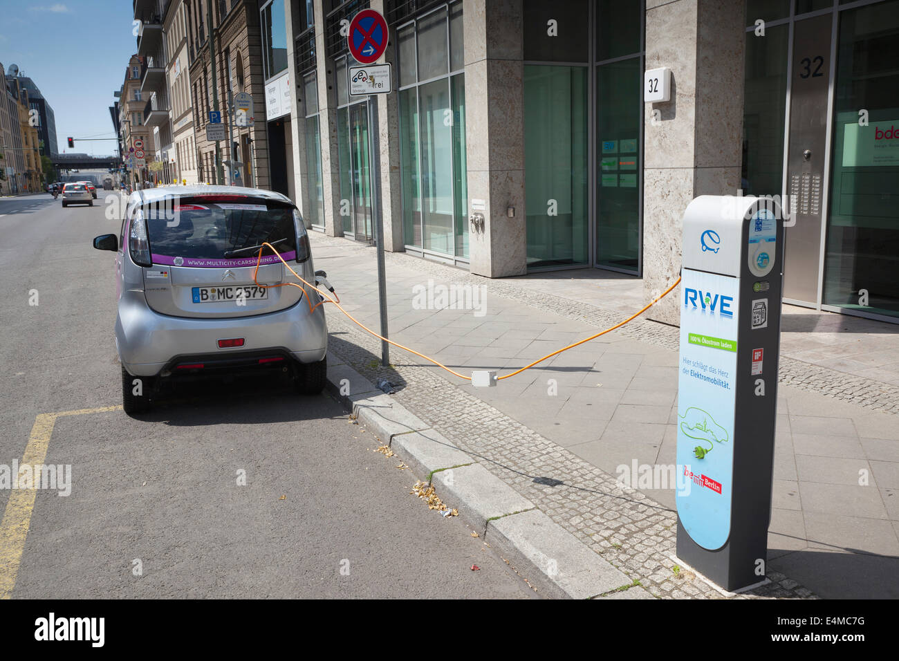Germany, Berlin, Mitte, Citroen electric car being charged at roadside ...