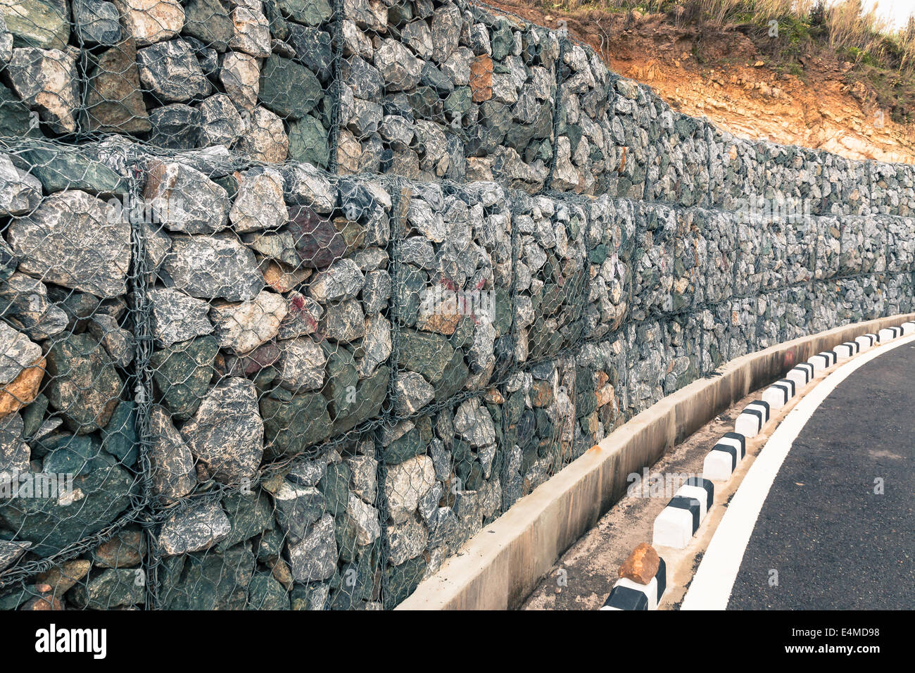 Wall rock landslides, protective gabion wall in mountains Stock Photo ...