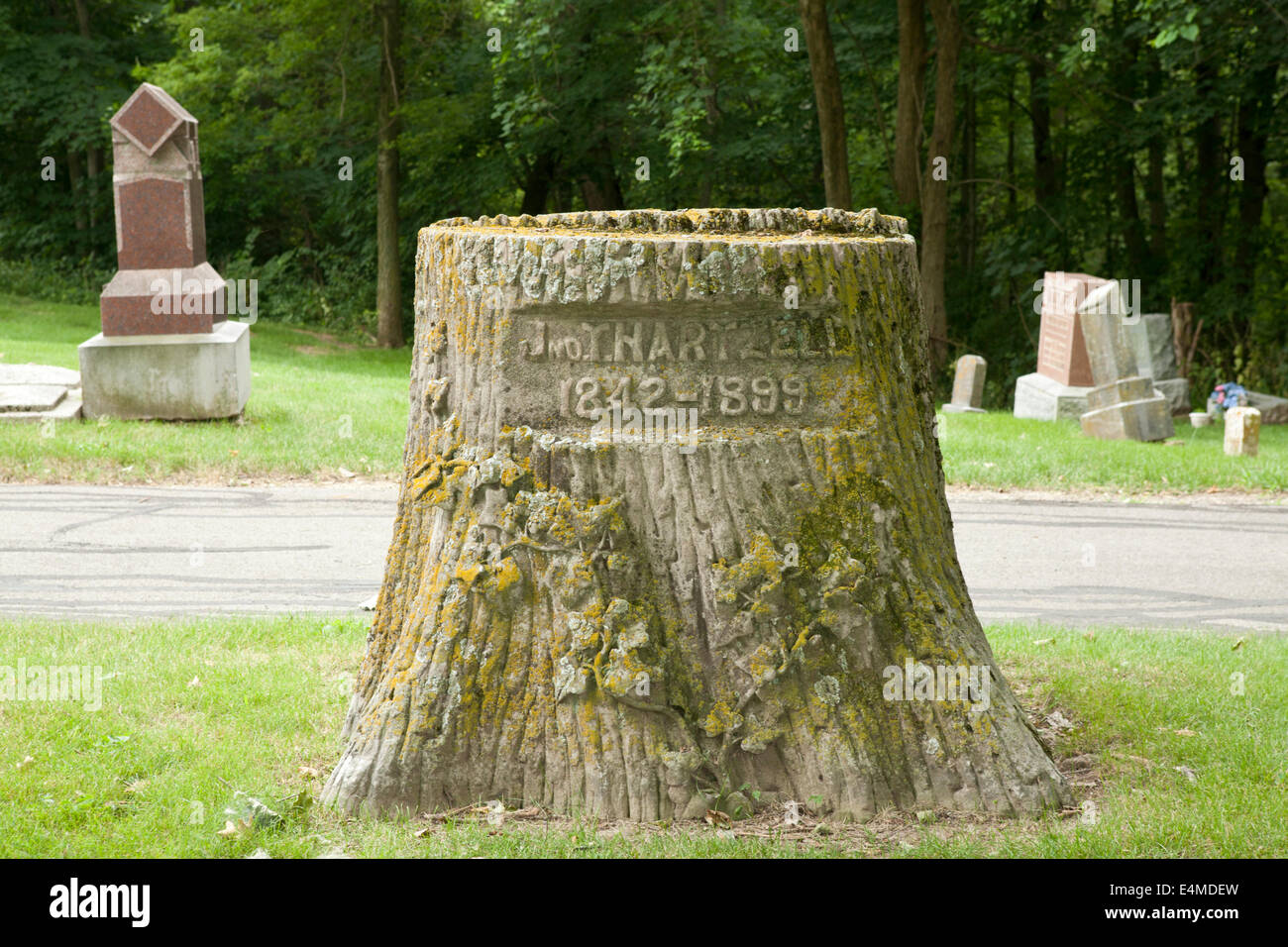Tree stump gravestone Stock Photo - Alamy