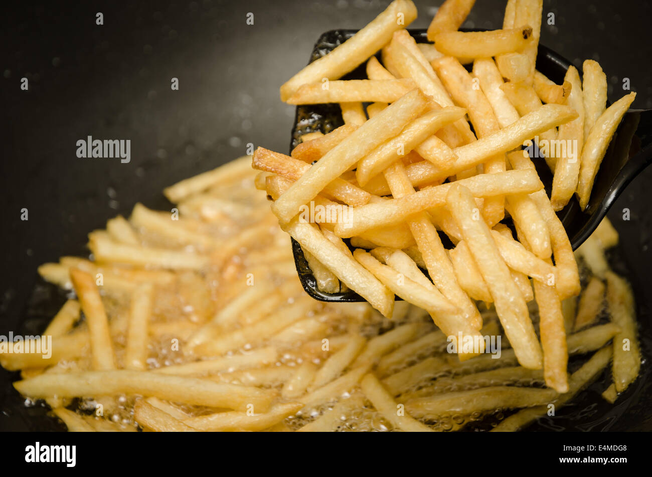 French fries in a hot pan Stock Photo - Alamy