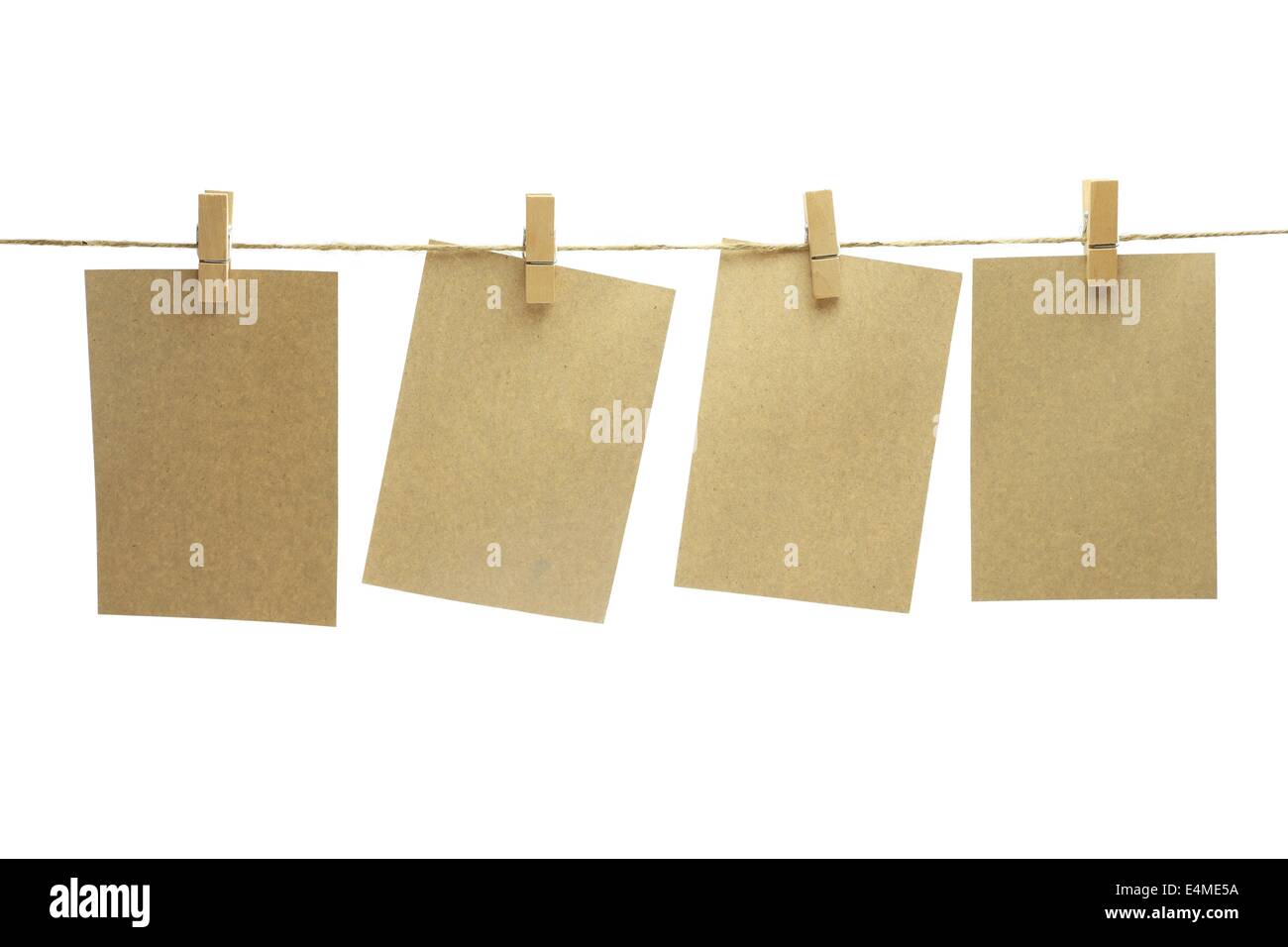 Brown paper hang on the rope with wooden clip isolated on a white ...