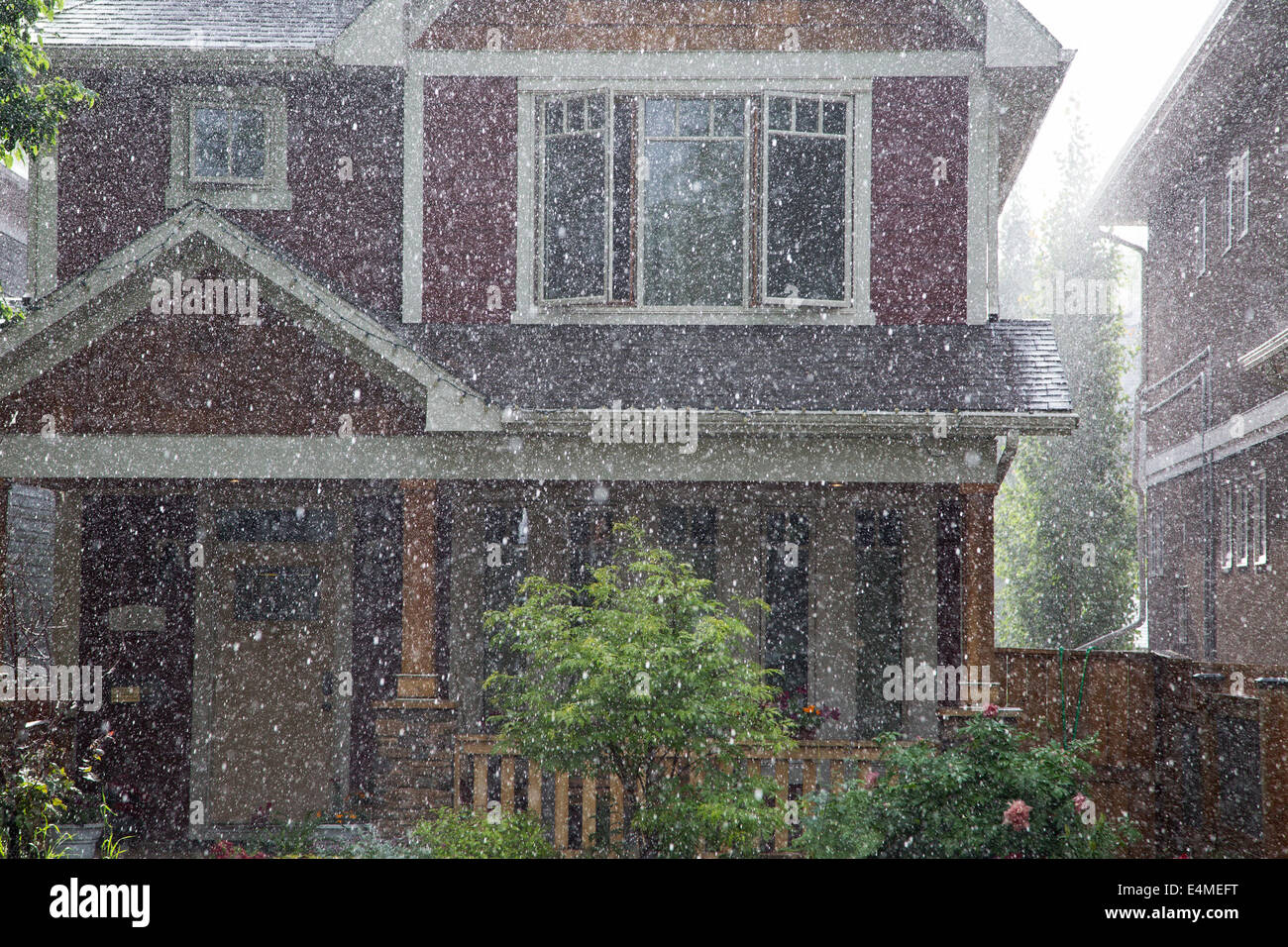Hail storm and house in city neighborhood Stock Photo - Alamy