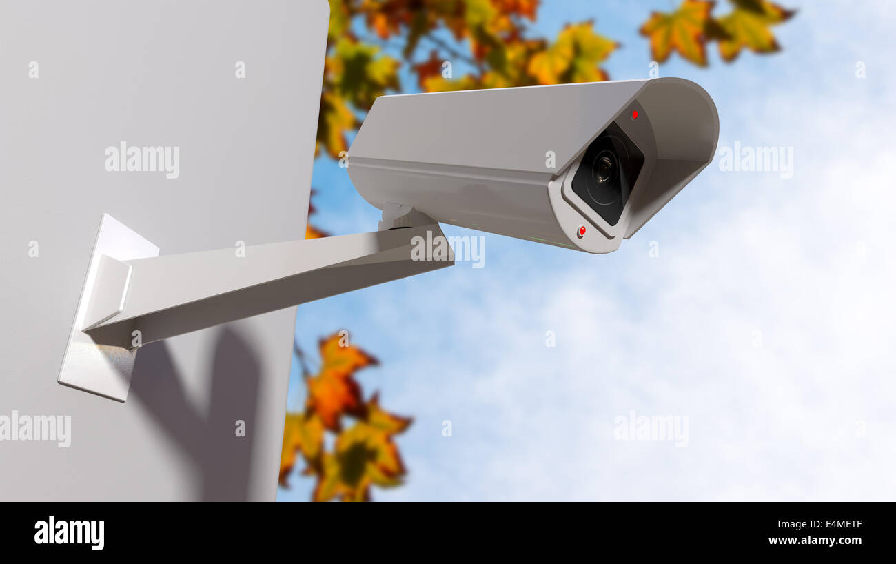 A white wireless surveillance camera with illuminated lights mounted on ...