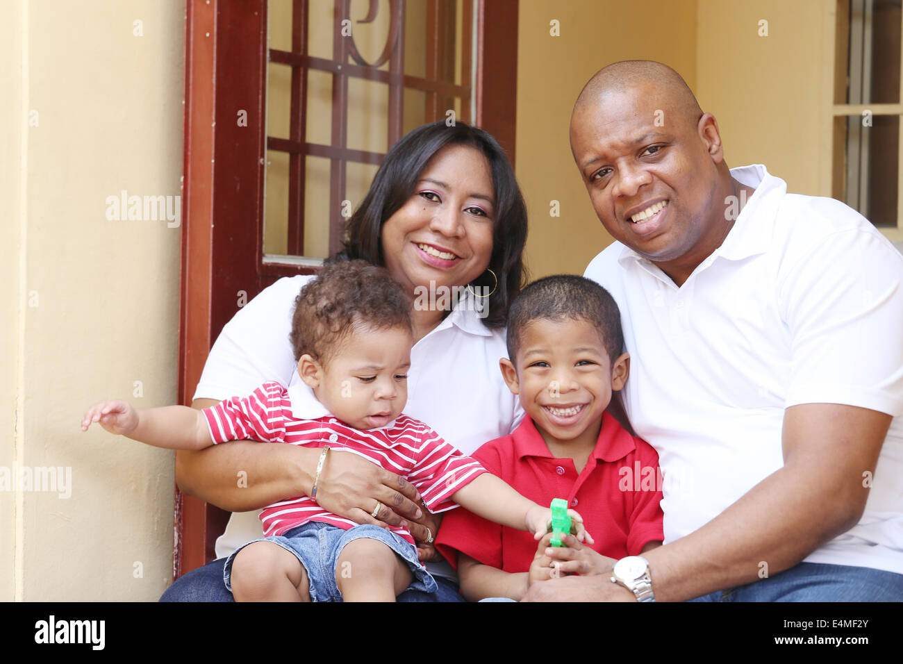 Happy african family in their new house Stock Photo - Alamy