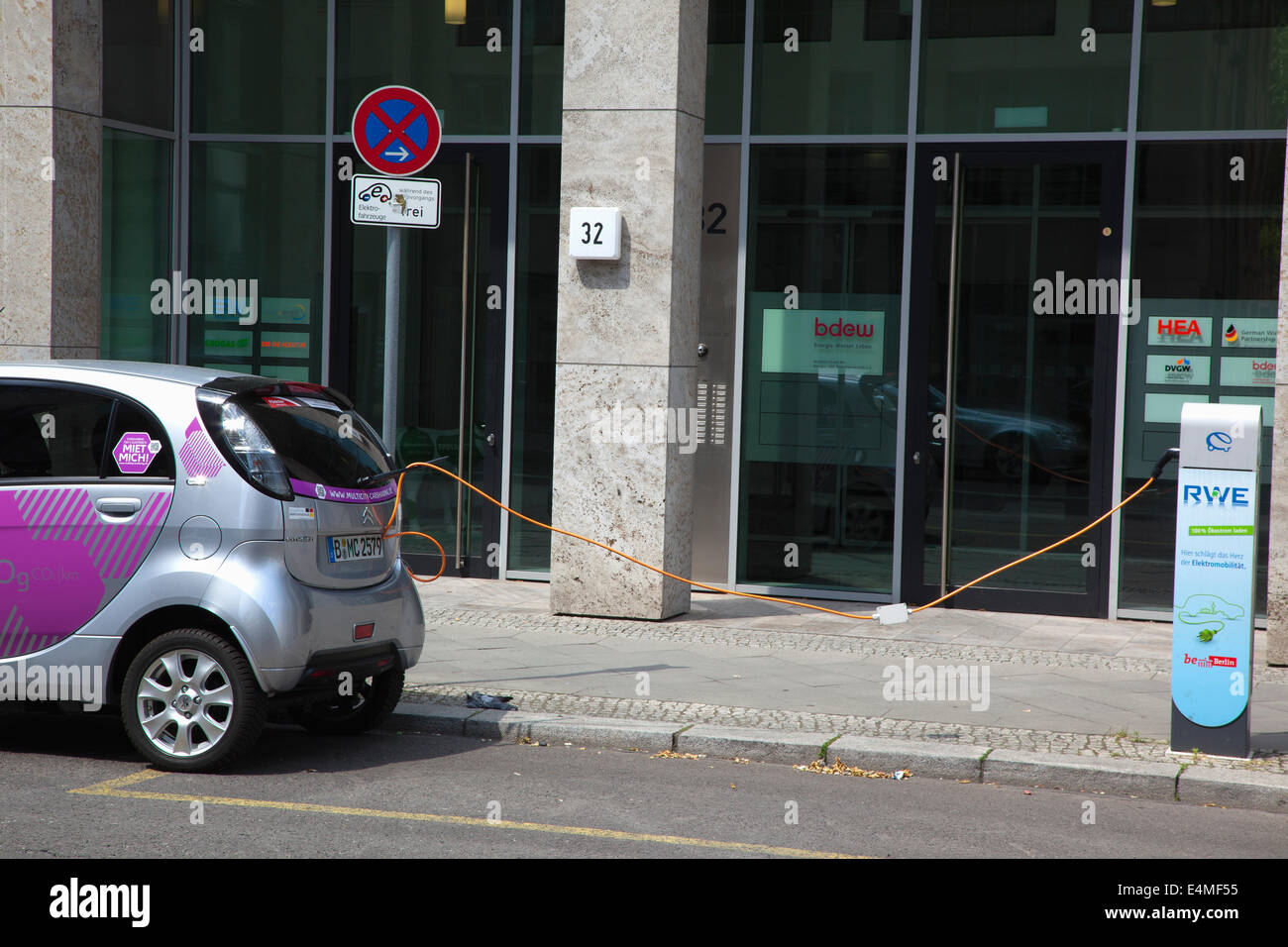 Germany, Berlin, Mitte, Citroen electric car being charged at roadside ...