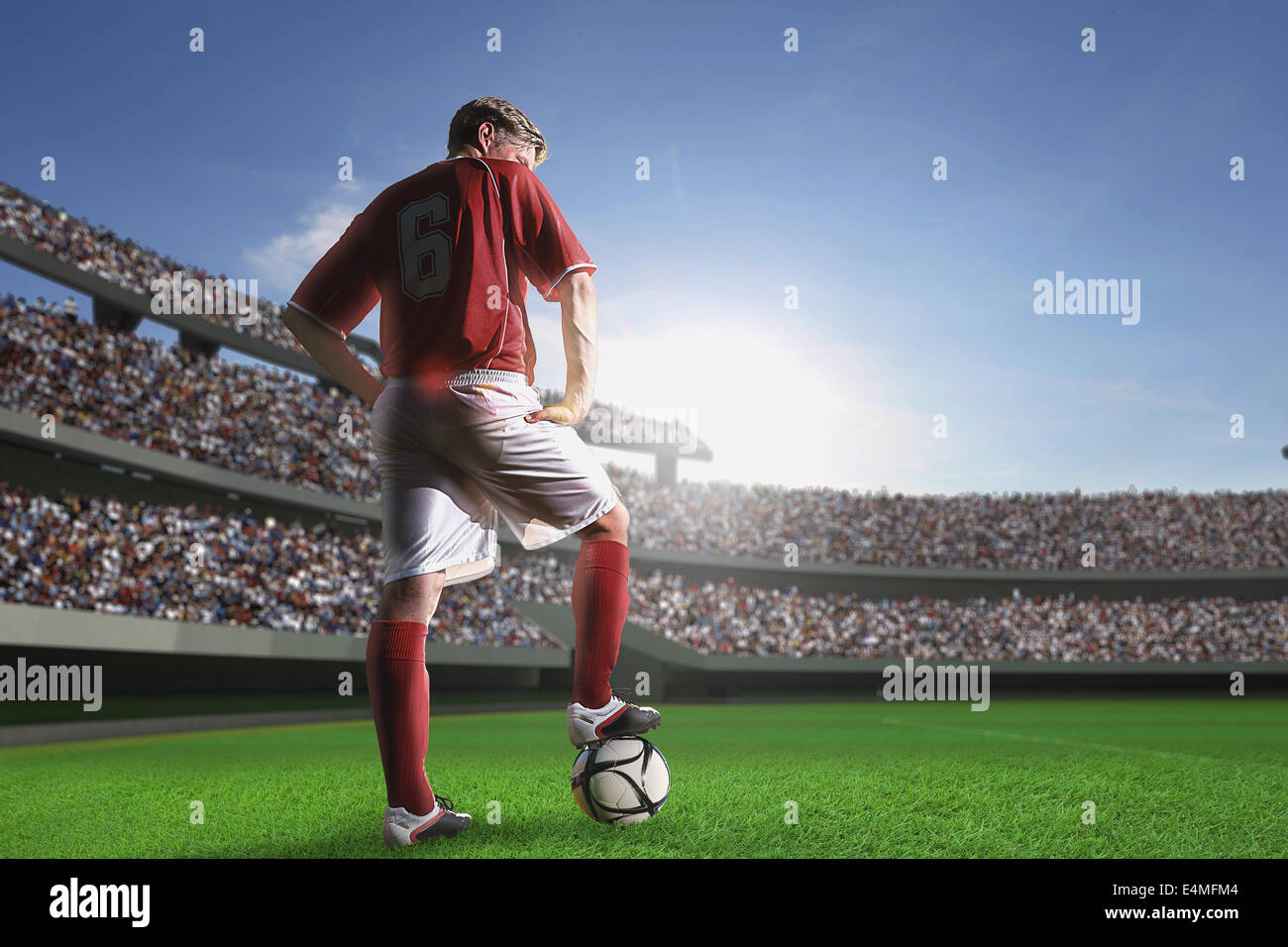 Soccer Player Standing With Ball Stock Photo - Alamy
