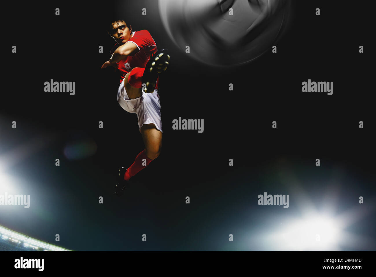 Kicking soccer ball player in hi-res stock photography and images - Alamy