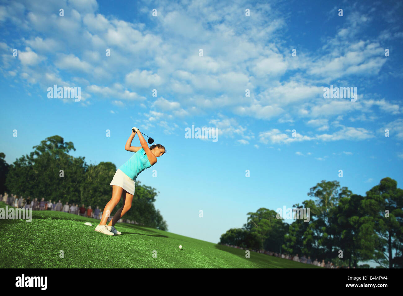 Female Golfer Teeing Off Stock Photo - Alamy