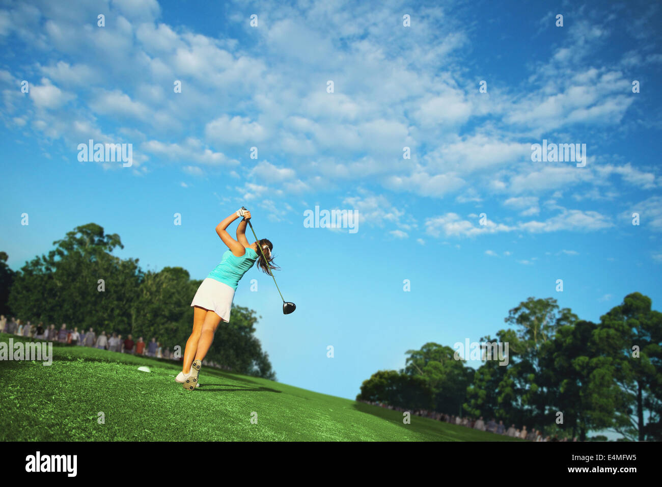 Female Golfer Teeing Off Stock Photo - Alamy
