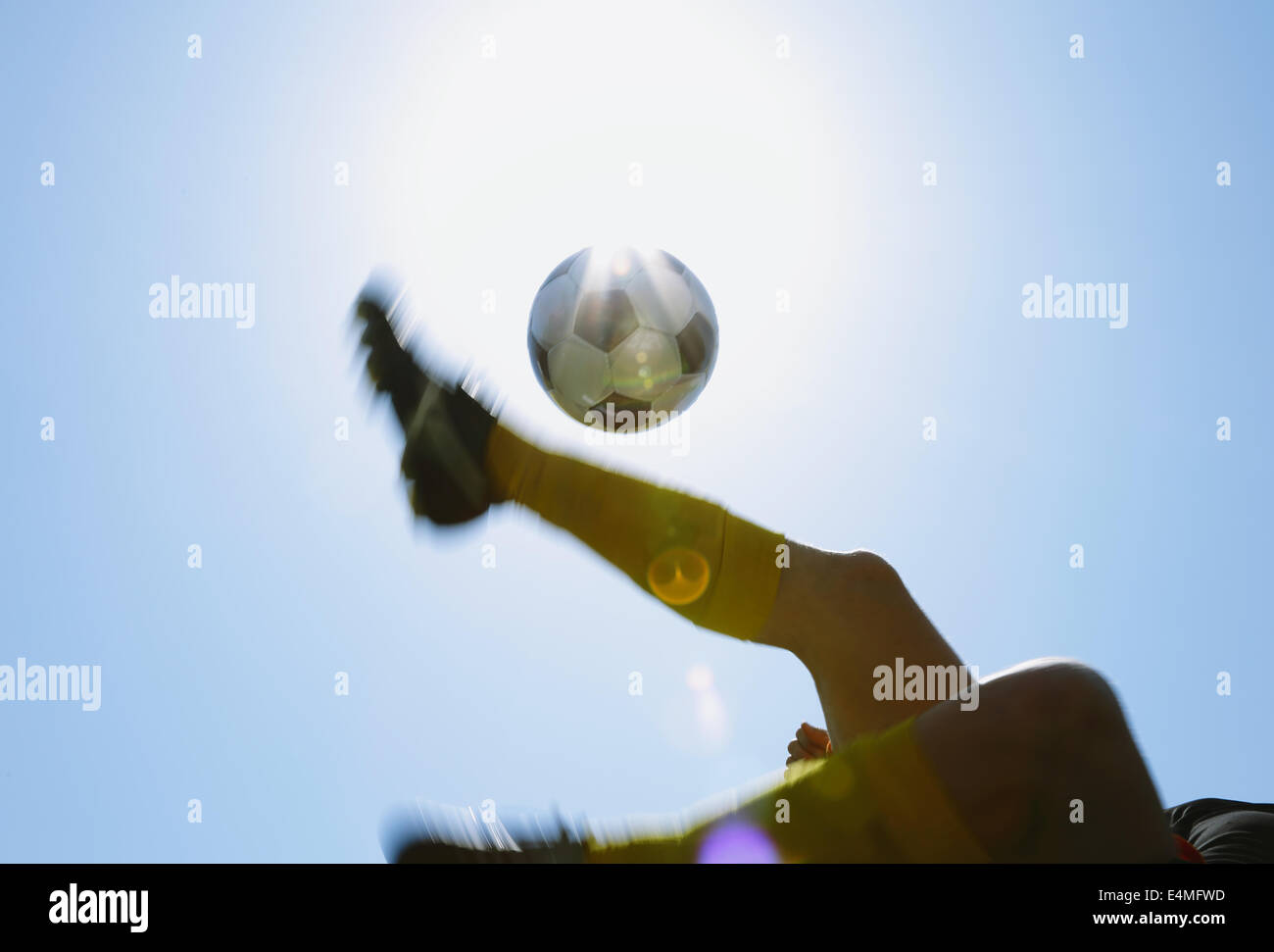 Football player kicking ball hi-res stock photography and images - Alamy