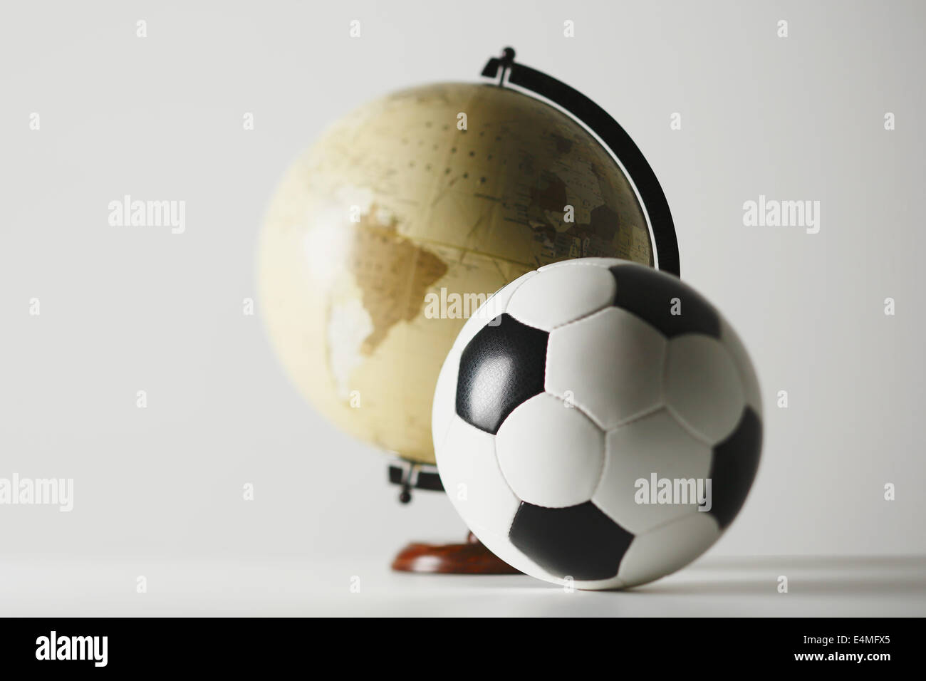 Soccer ball and globe Stock Photo - Alamy