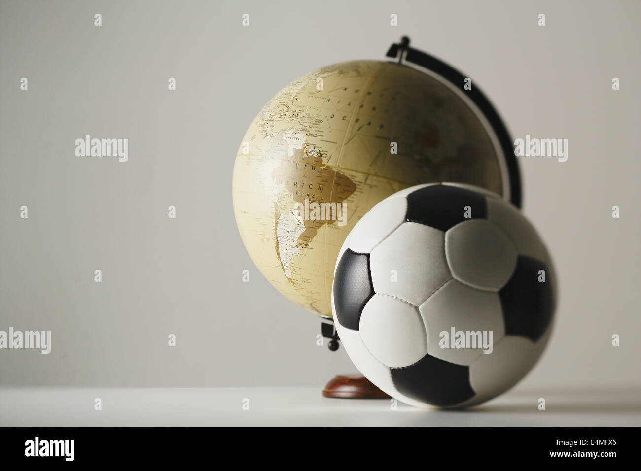 Soccer ball and globe Stock Photo - Alamy