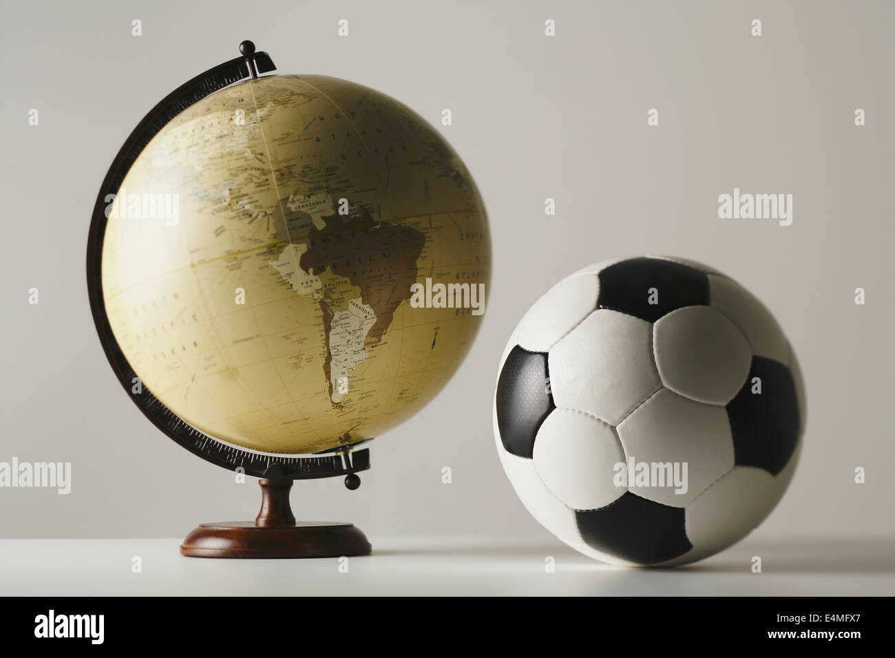 Soccer ball and globe Stock Photo - Alamy