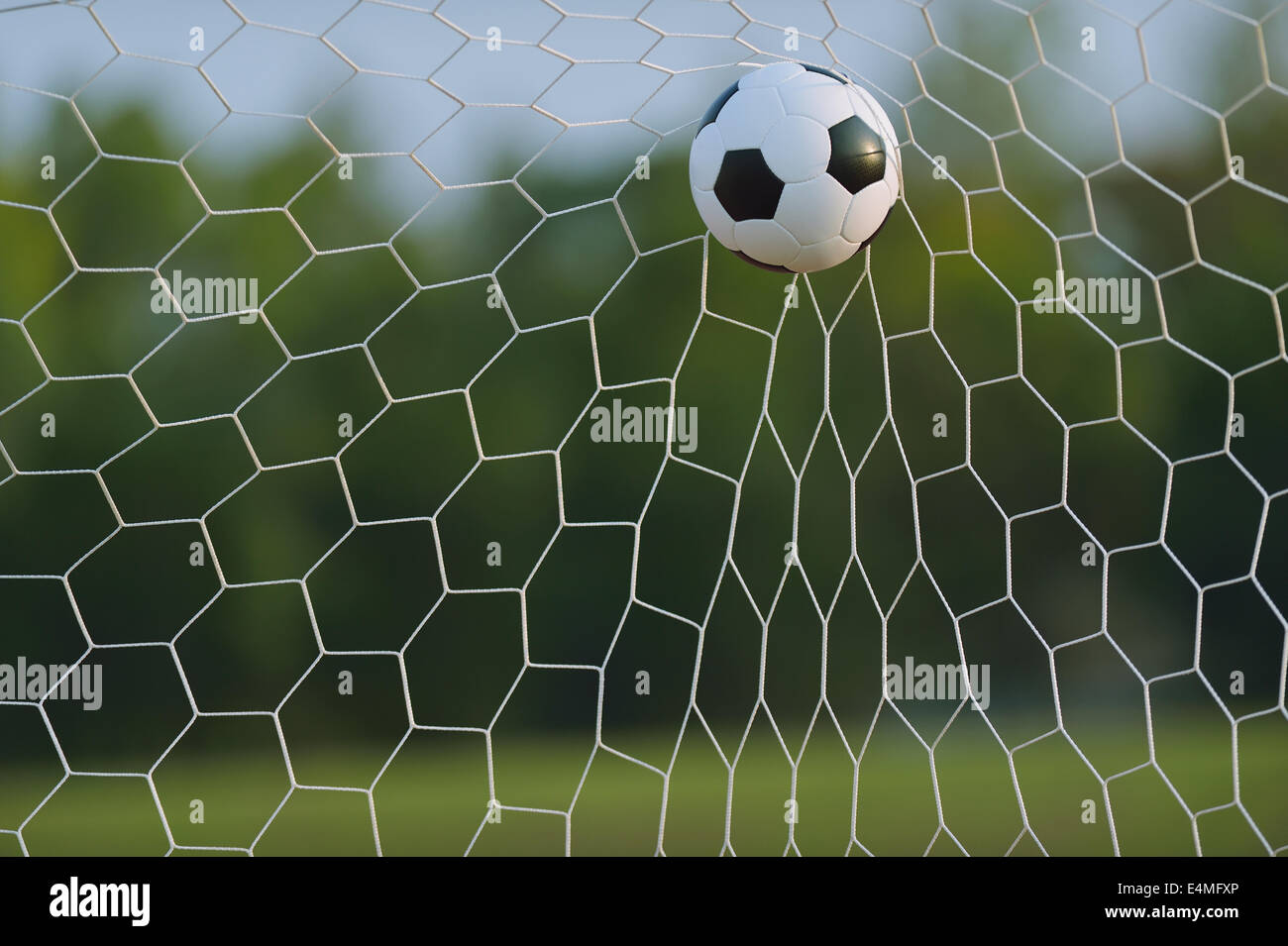 Soccer ball in net hi-res stock photography and images - Alamy