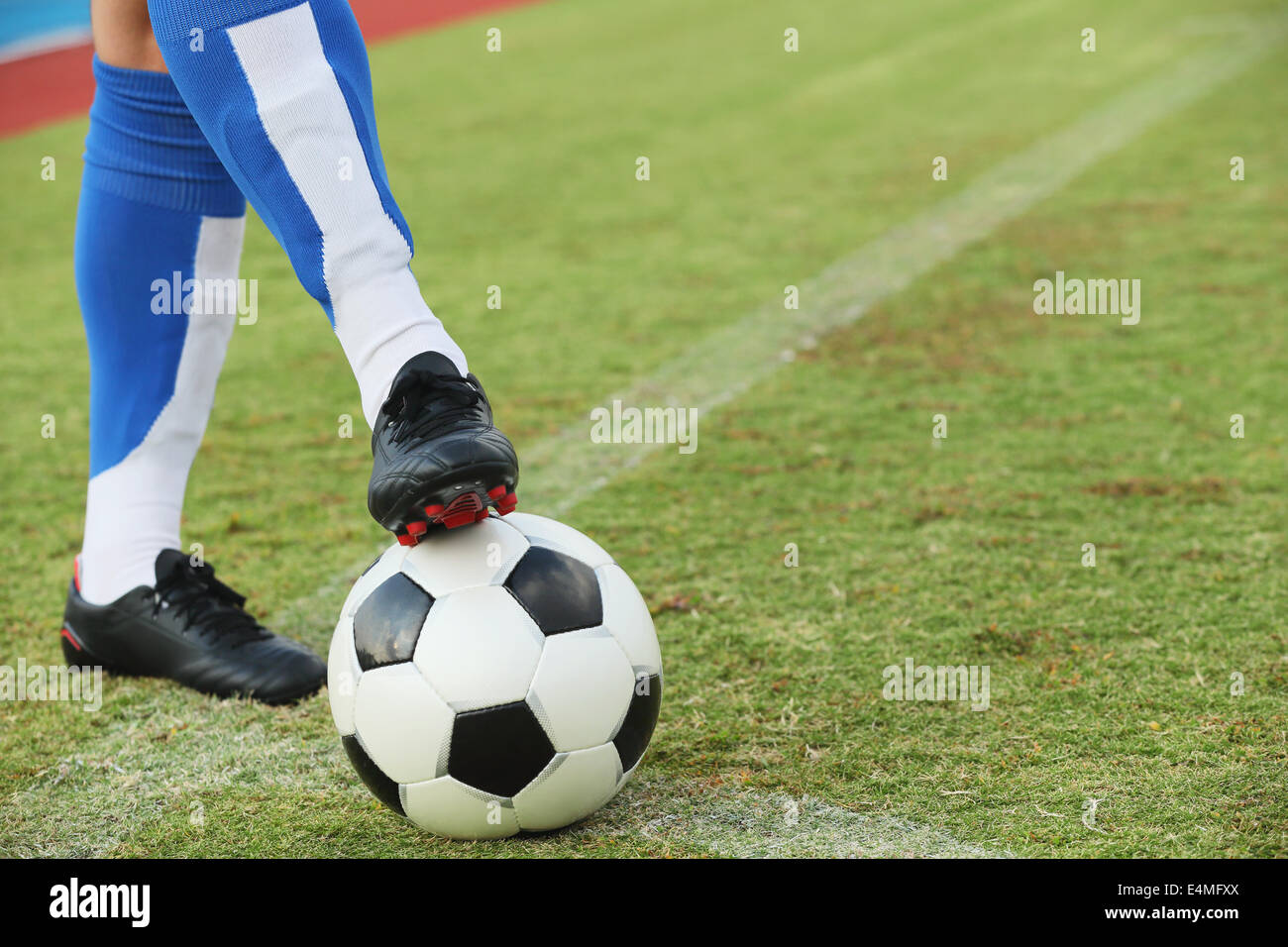 Football player stopping the ball Stock Photo - Alamy
