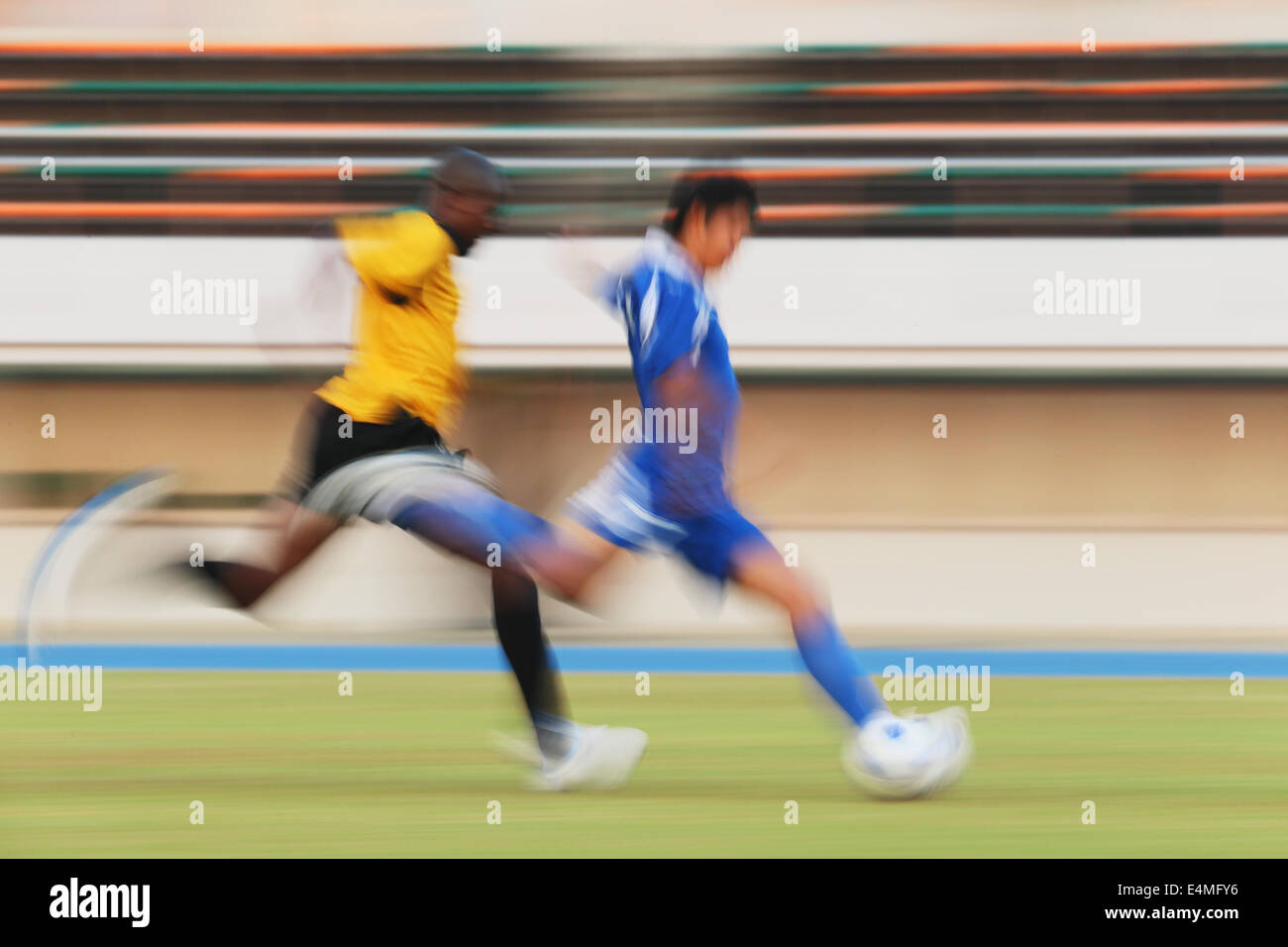 Two soccer players running ball hi-res stock photography and images - Alamy