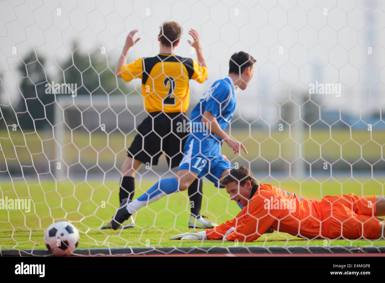 Football players after goal Stock Photo - Alamy