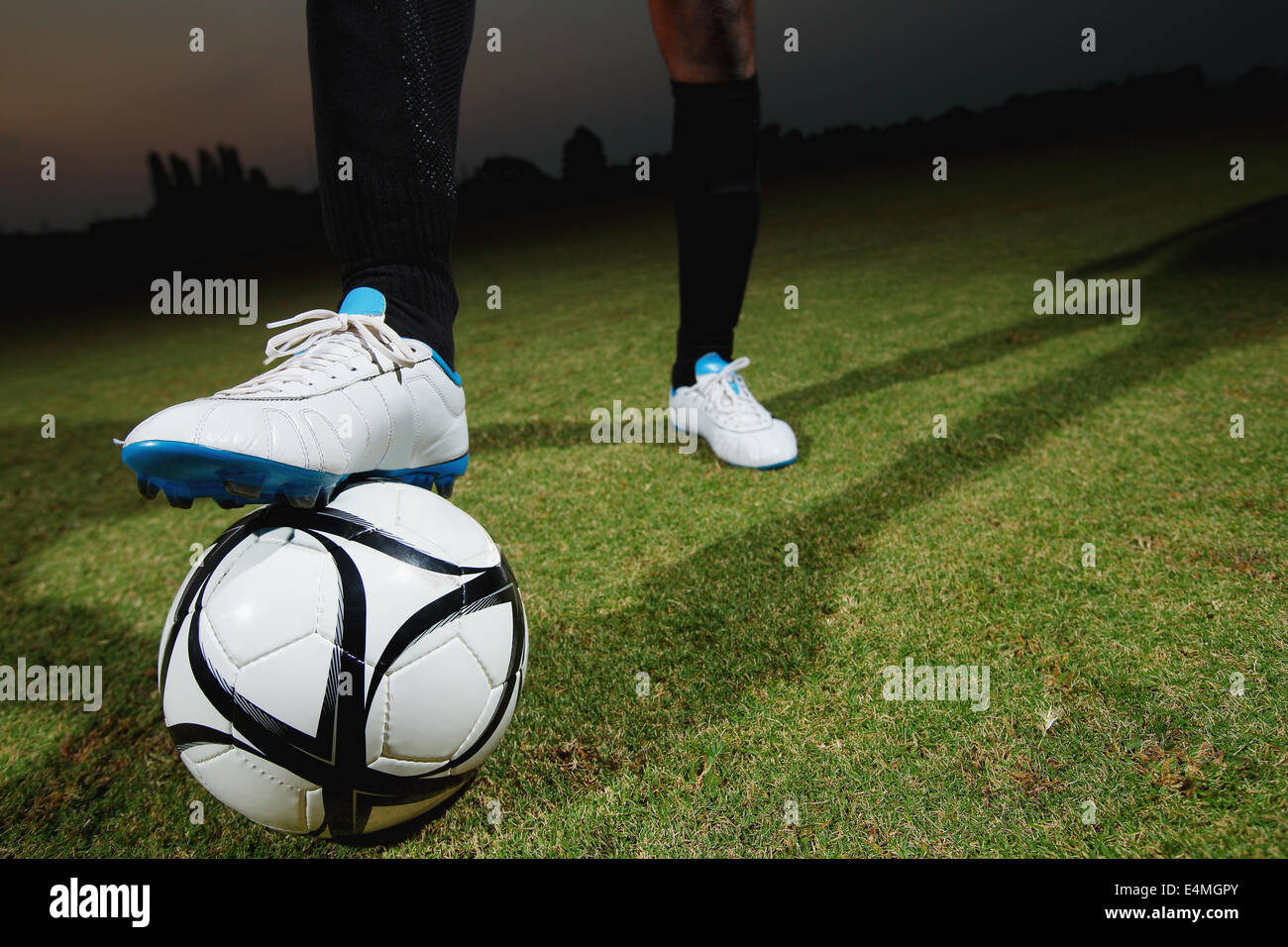 Football player stopping the ball Stock Photo - Alamy