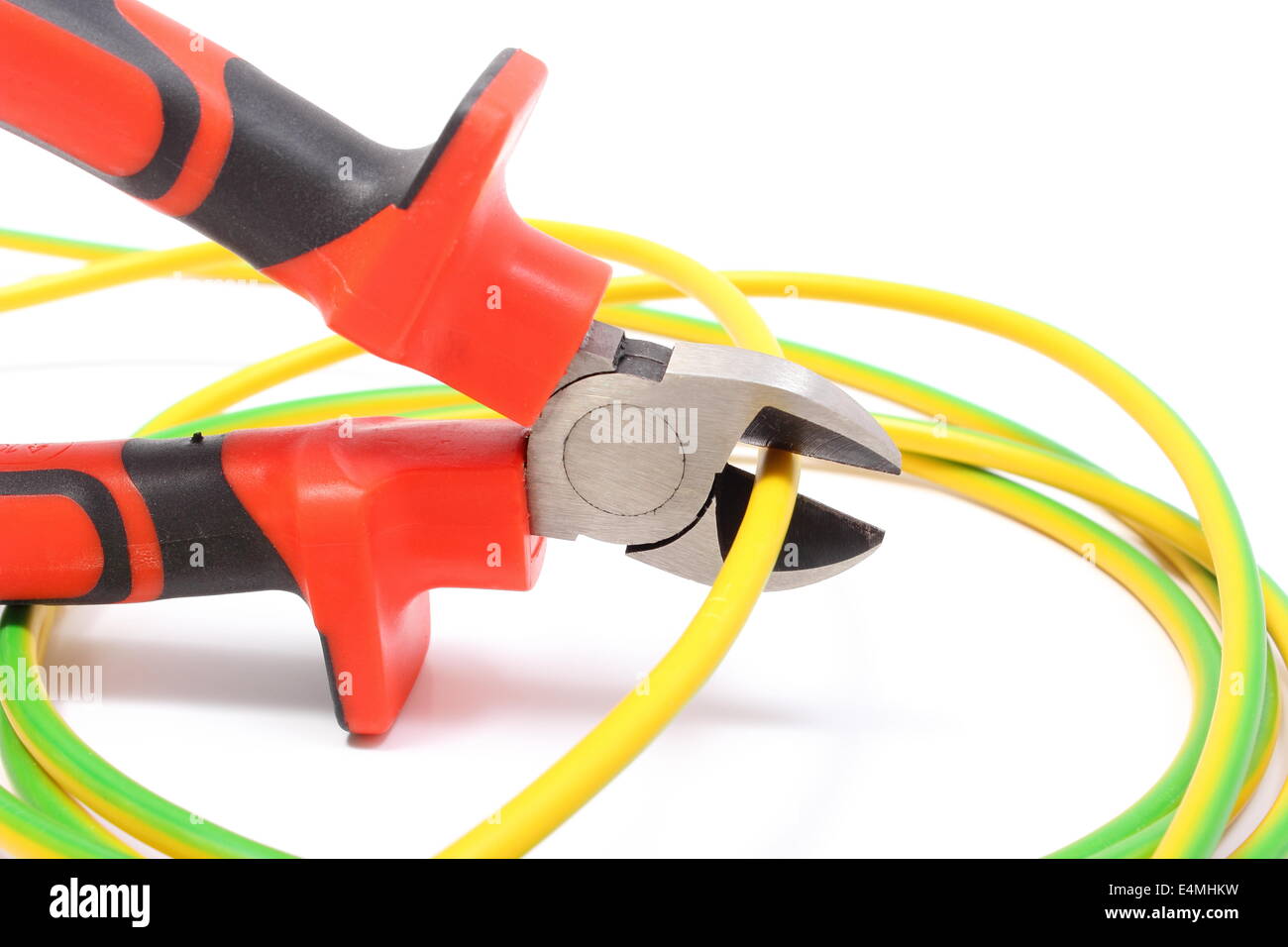 Metal pliers with tangled green-yellow electric cable, pliers cut the ...