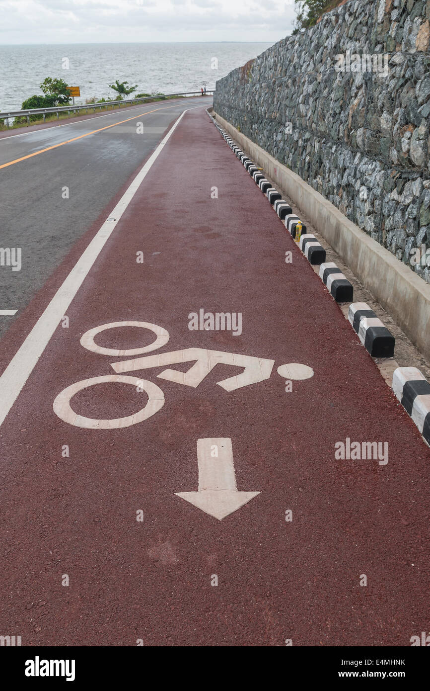 Cyclists symbol sign painted on the road Stock Photo - Alamy