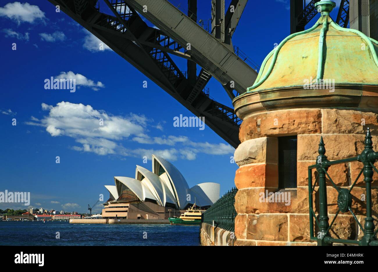 Classic shot of the Sydney Opera House with a blue sky and puffy clouds ...